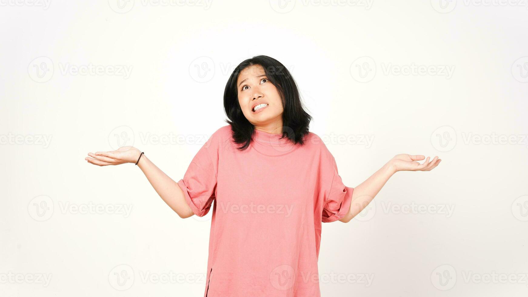 Young asian woman shrugging shoulders with open hands on white ...