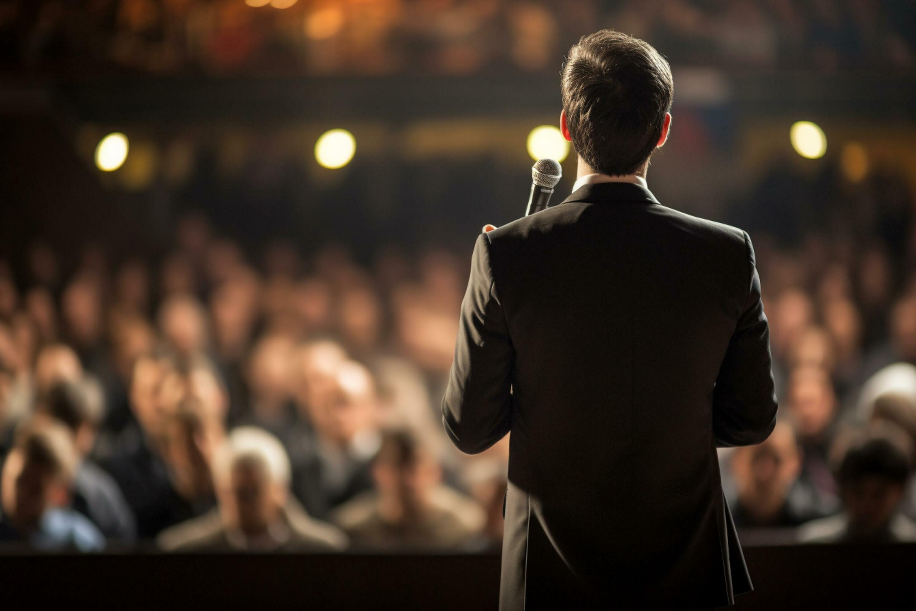 AI generated a man speaking in front of crowd people bokeh style background with Generative AI ...