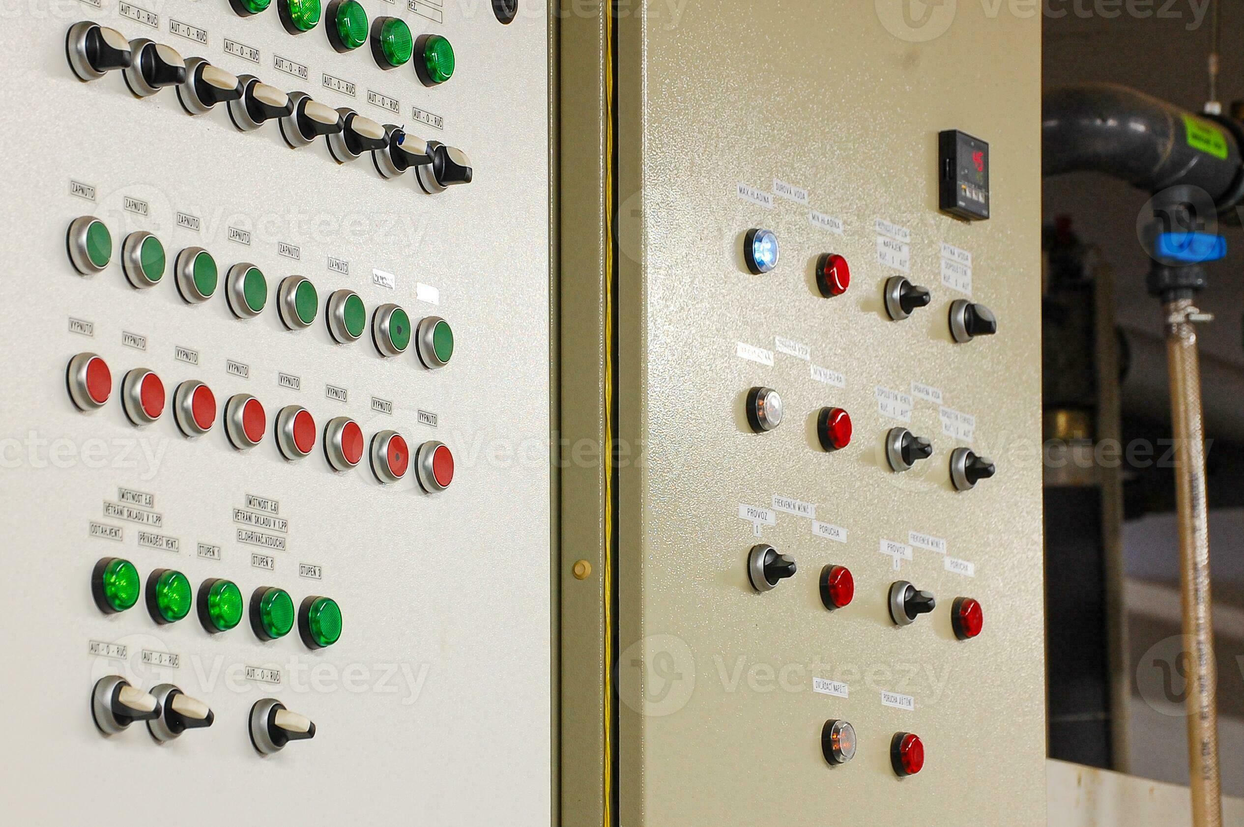 Switches on an industrial control board. Lamp indicator and switch of power control panel ...