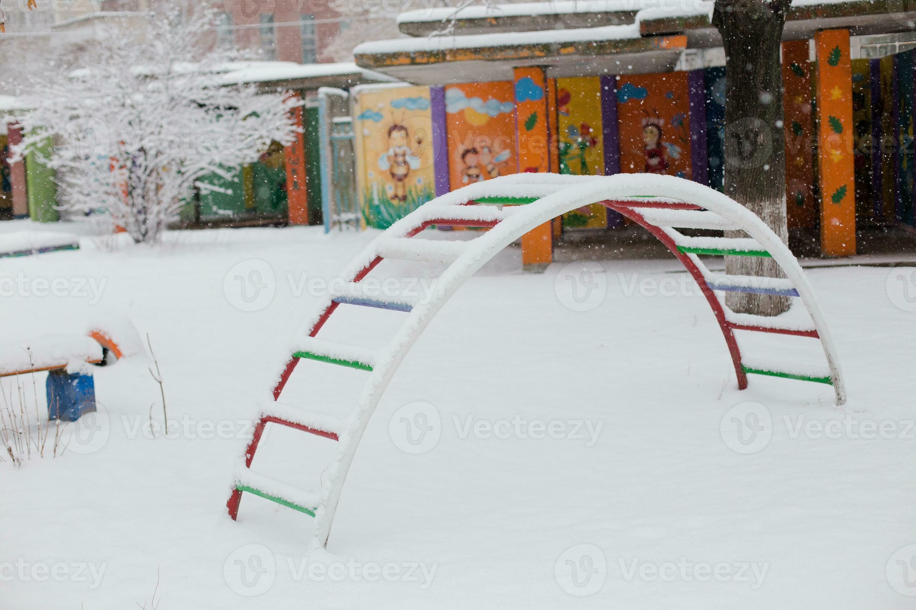Children's playground in the city park under the snow in winter. 36316930 Stock Photo at Vecteezy