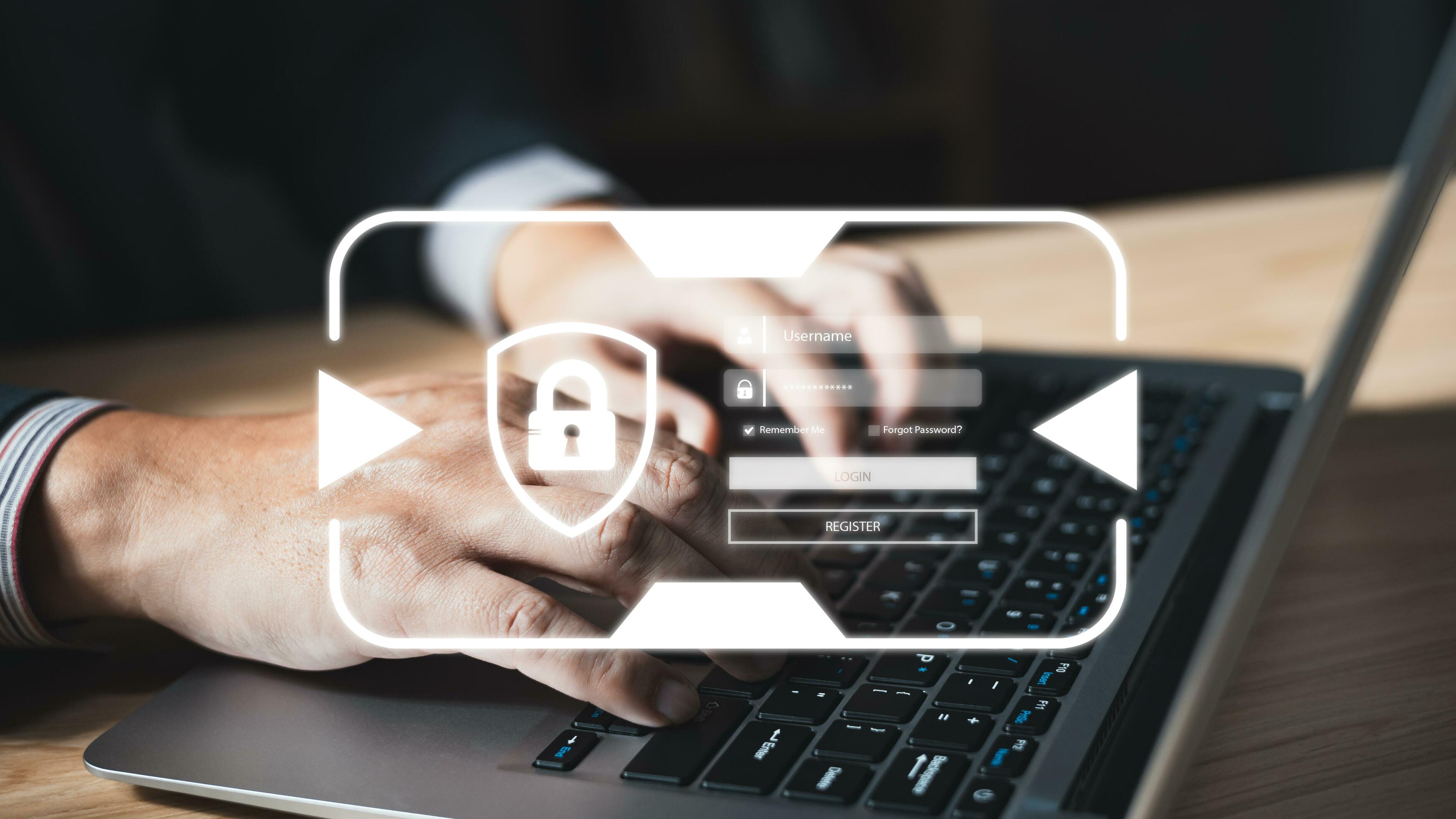 Businessman protecting personal data on laptop with virtual screen ...