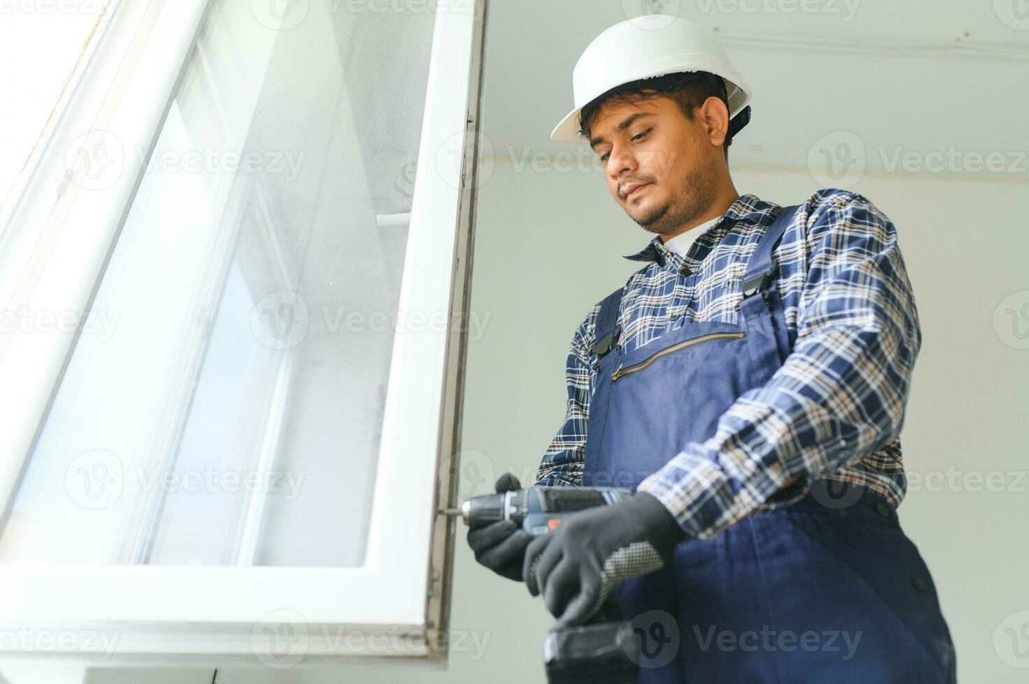 Indian service man installing window with screwdriver 36384464 Stock ... Indian service man installing window with screwdriver 36384464 Stock ...