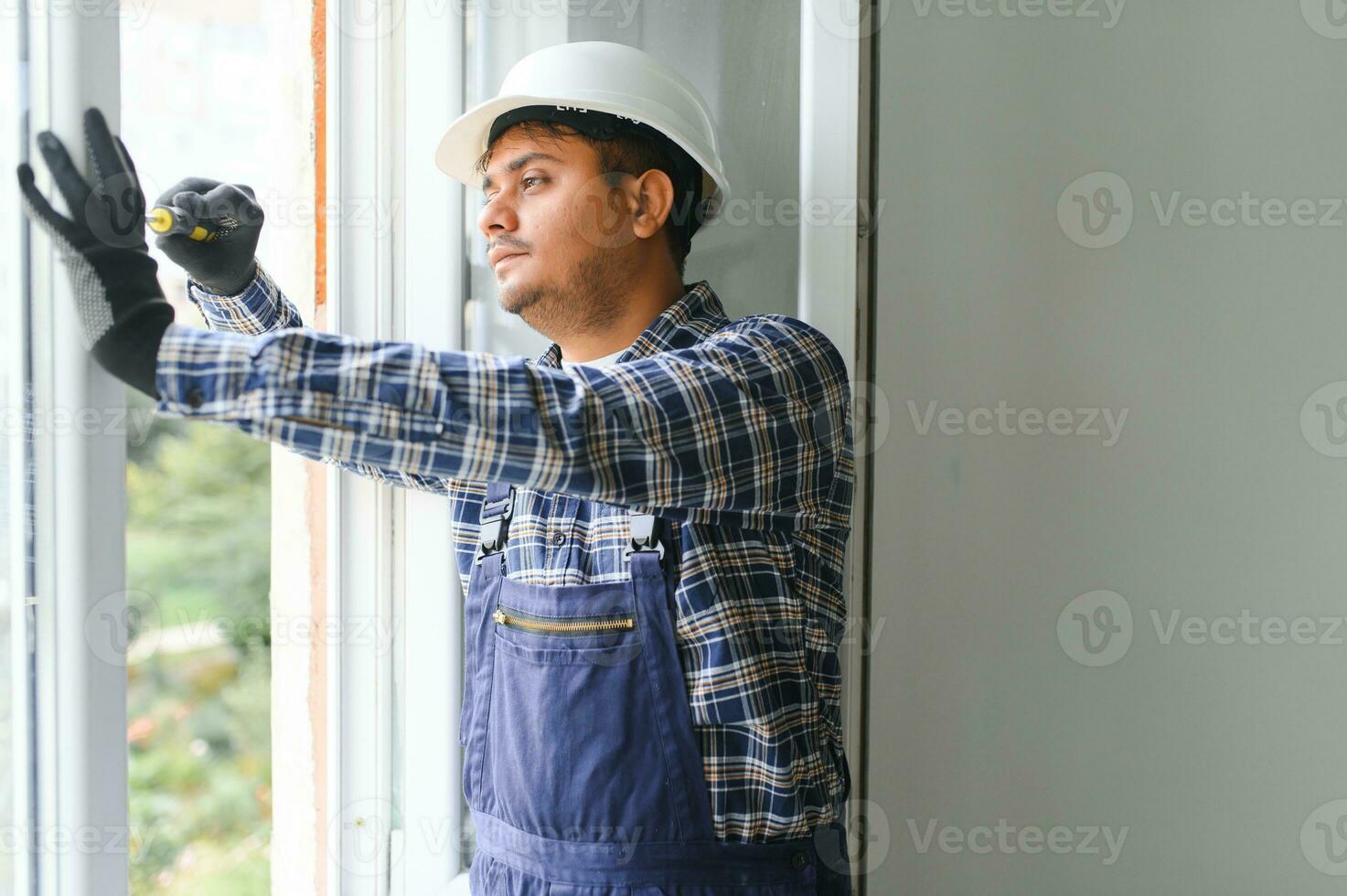 Indian service man installing window with screwdriver 36385020 Stock ... Indian service man installing window with screwdriver 36385020 Stock ...