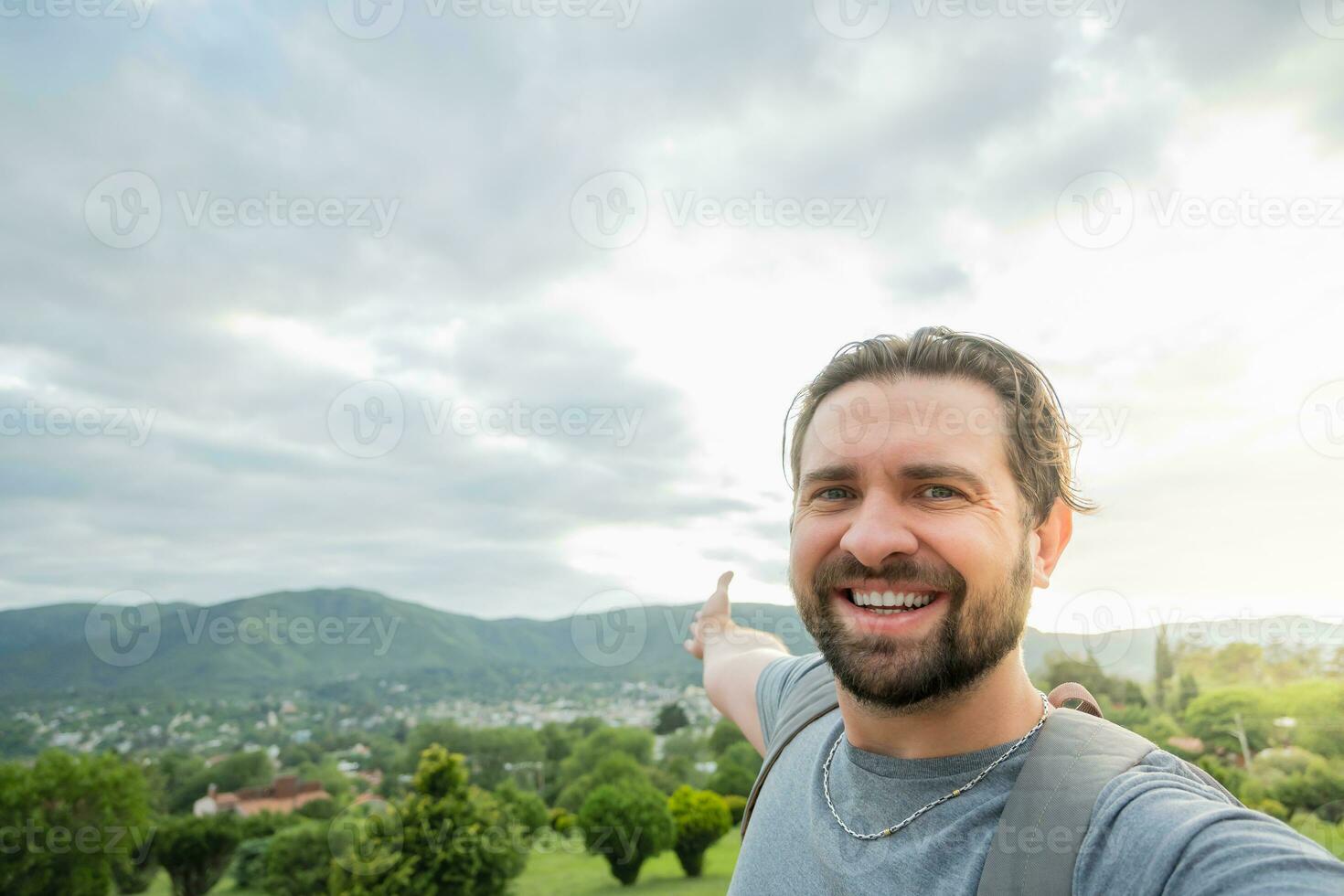 Handsome man taking selfie photo at sunrise on summer vacation. Happy ...