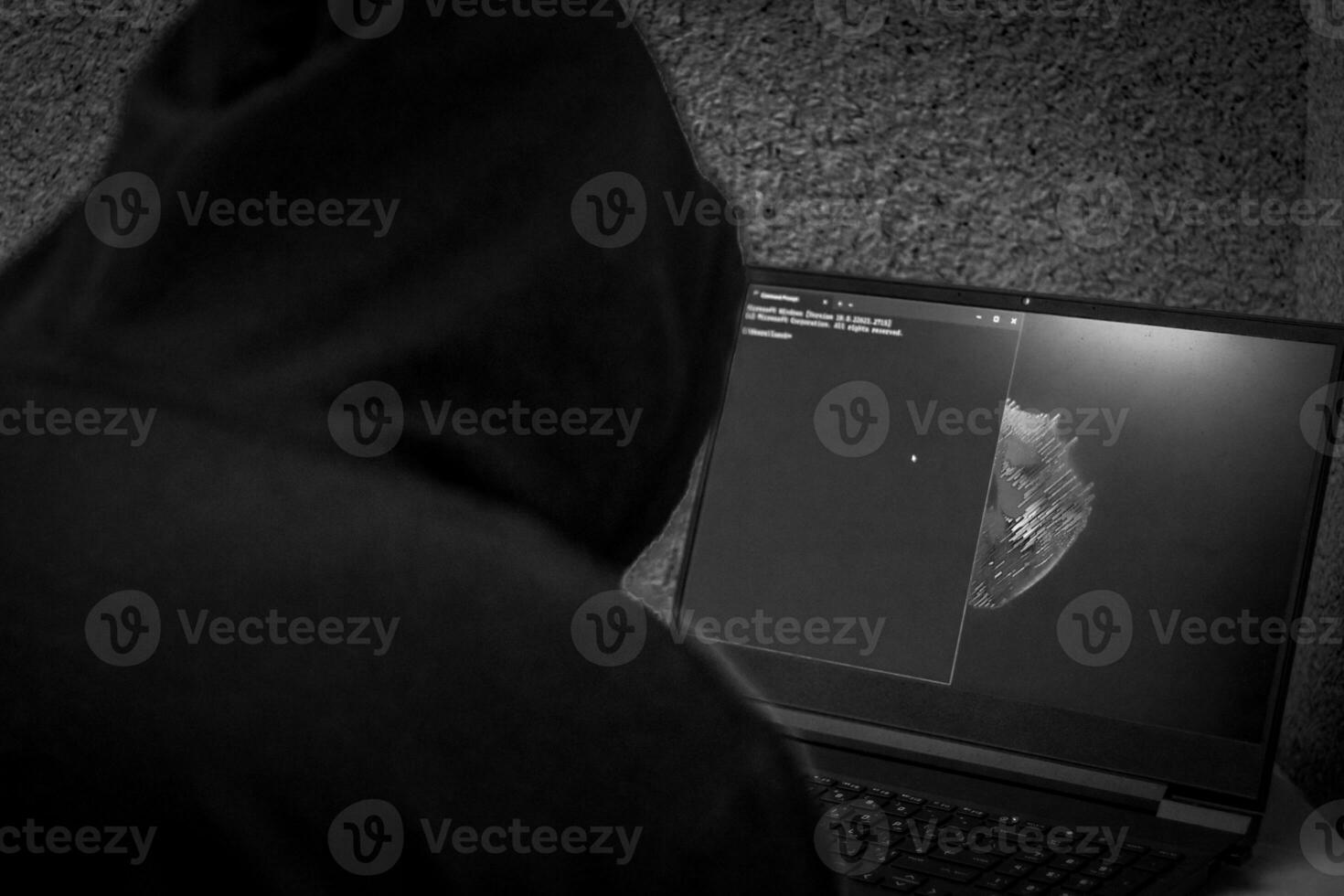 Man Looked Like Hacker In A Hood Sitting In The Front Of Laptop