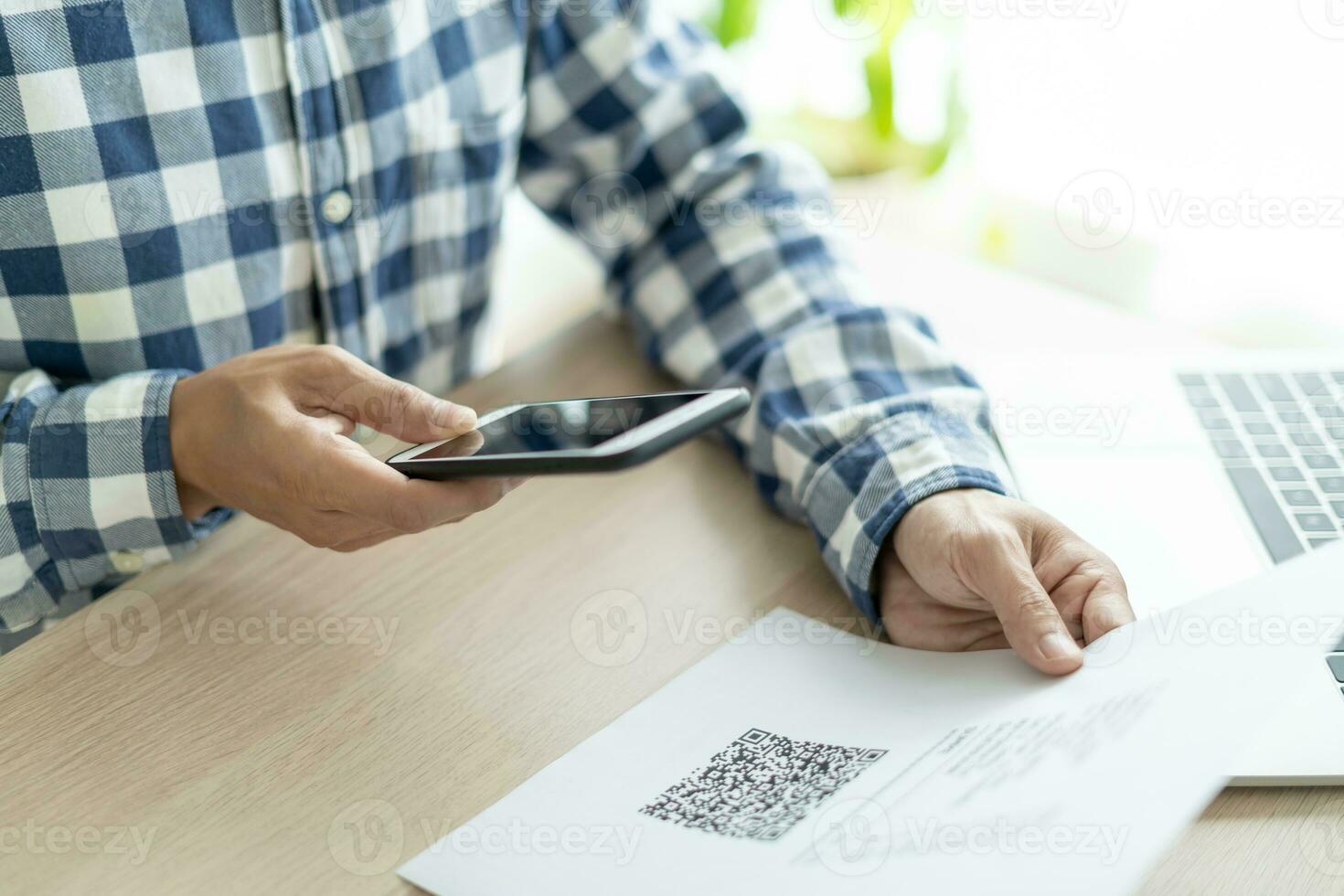 business man use phone to scan barcode or QR codes to pay credit card ... business man use phone to scan barcode or QR codes to pay credit card ...