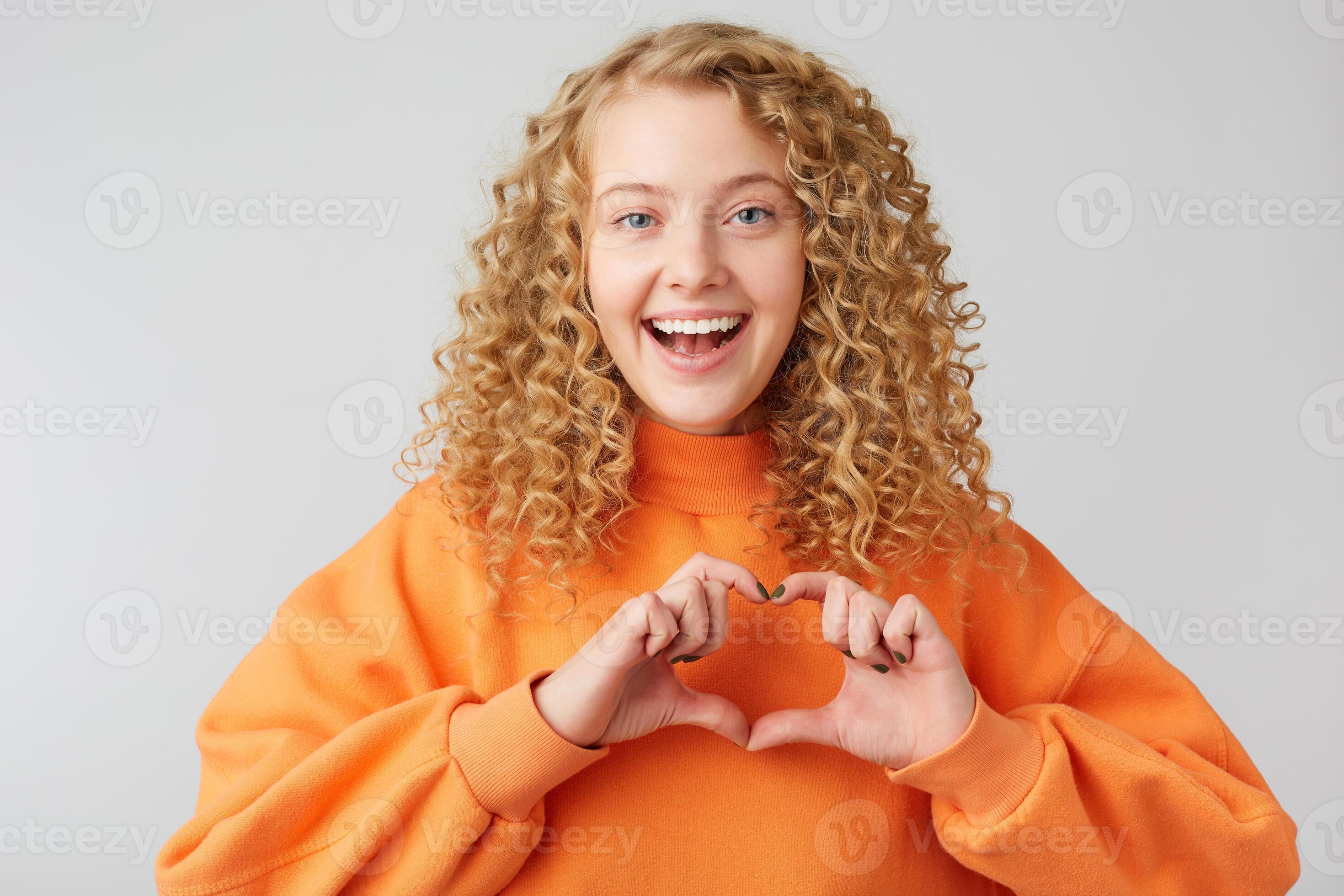 Beautiful young girl shows emotion on a white background. Girl shows ...