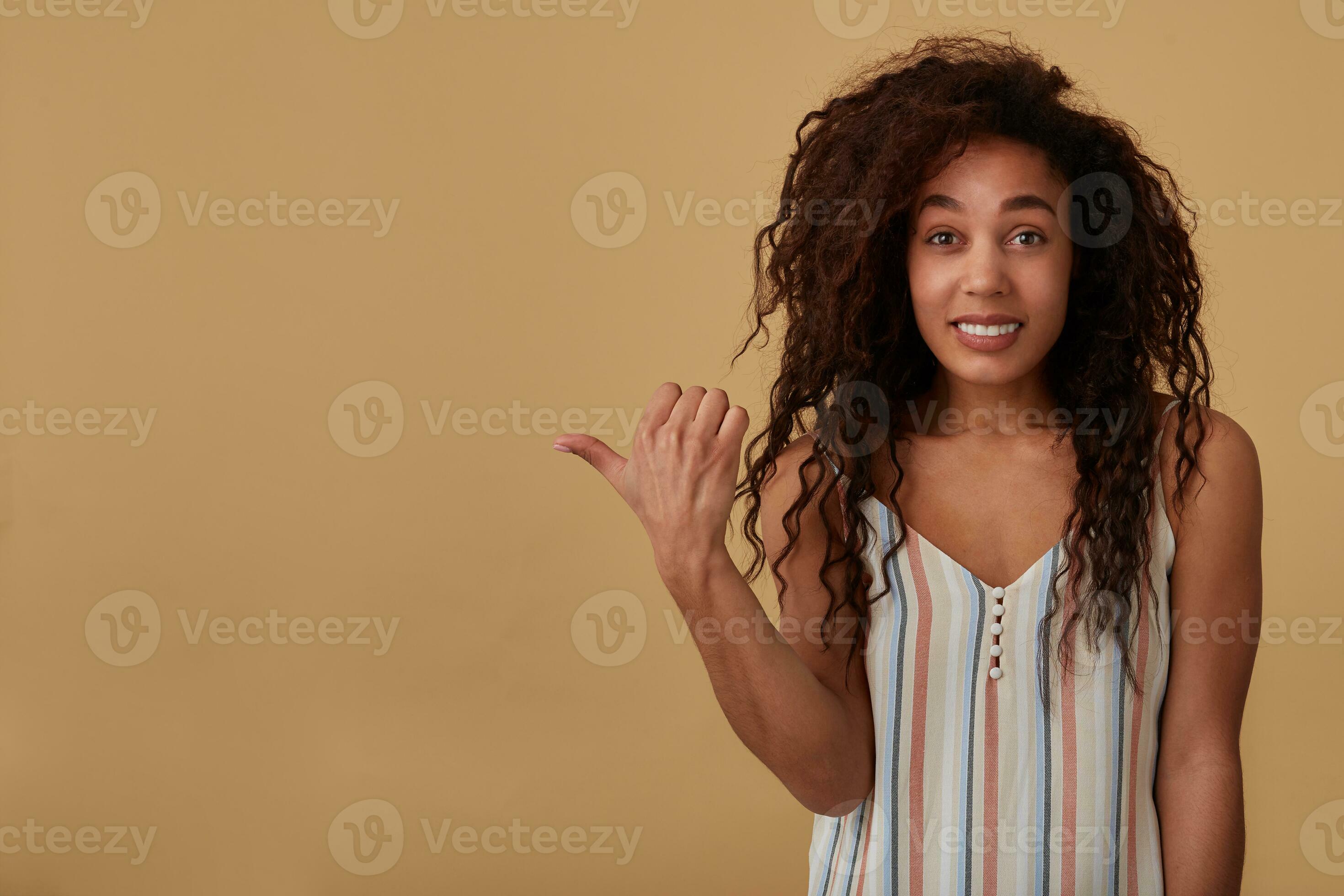 Agitated Young Pretty Long Haired Curly Brunette Female With Dark Skin