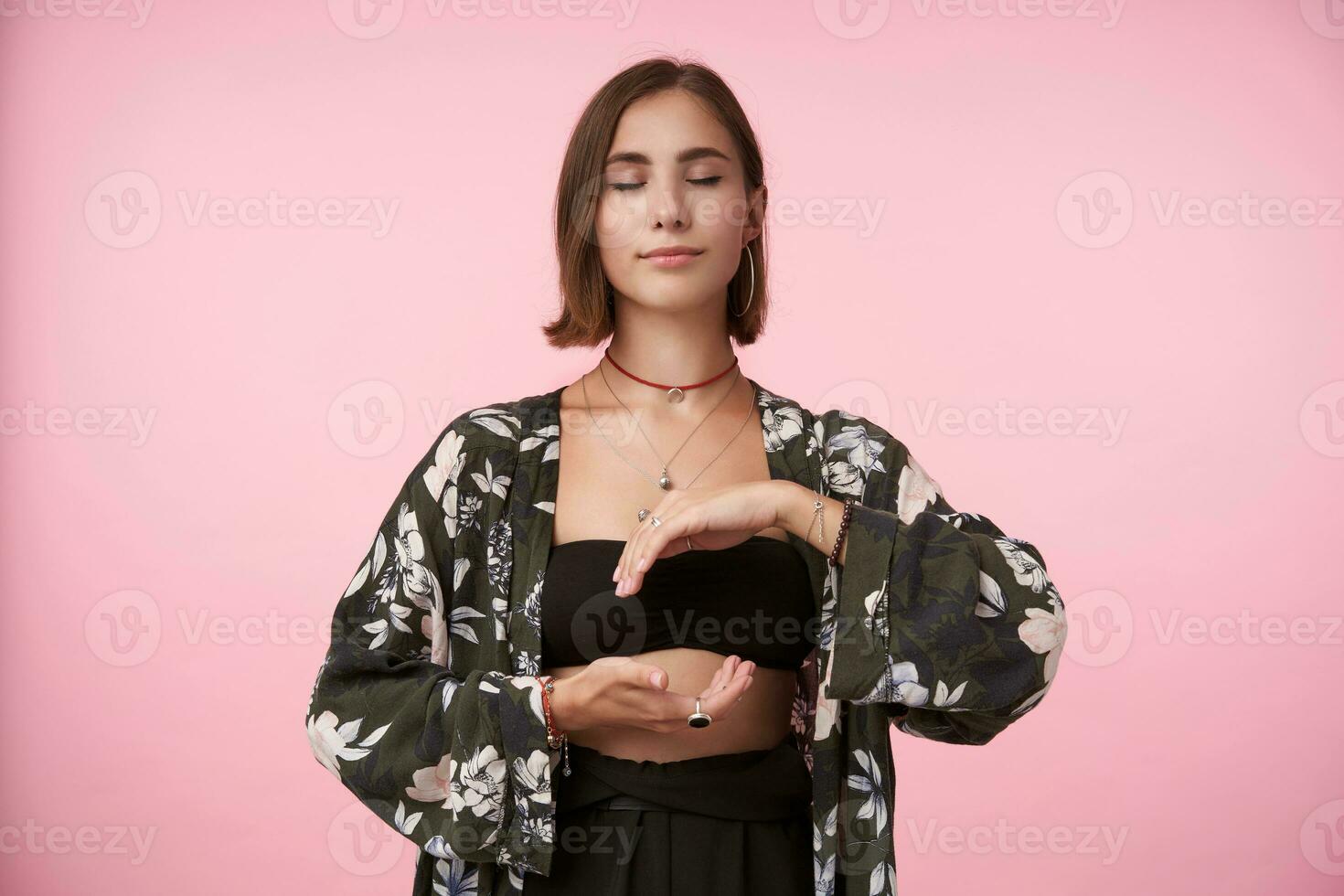 Good Looking Young Positive Short Haired Brunette Woman Keeping Her