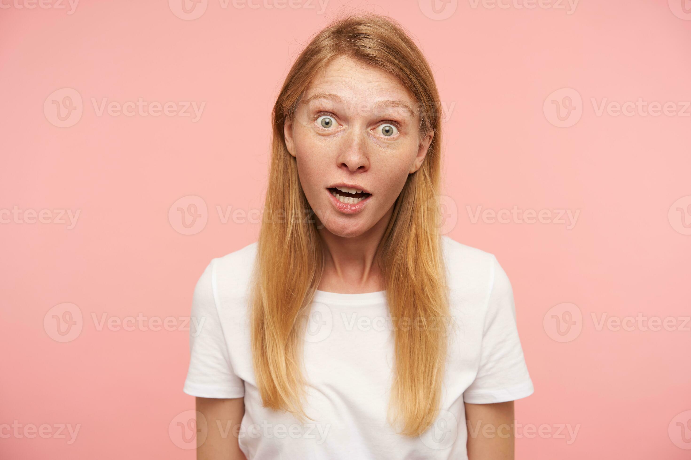 Surprised Young Lovely Long Haired Redhead Female With Natural Makeup