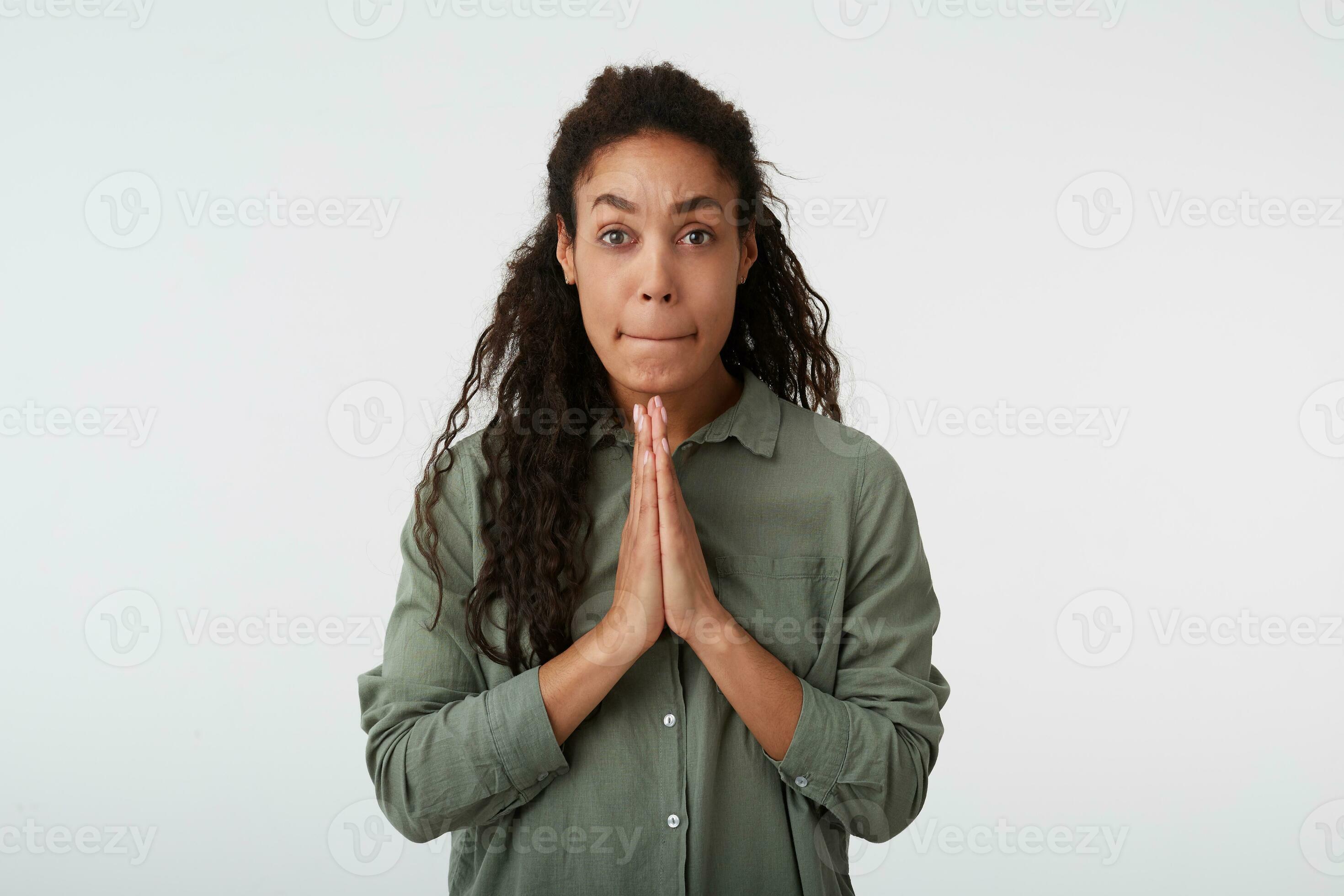 Bewildered Young Attractive Long Haired Curly Dark Skinned Woman With