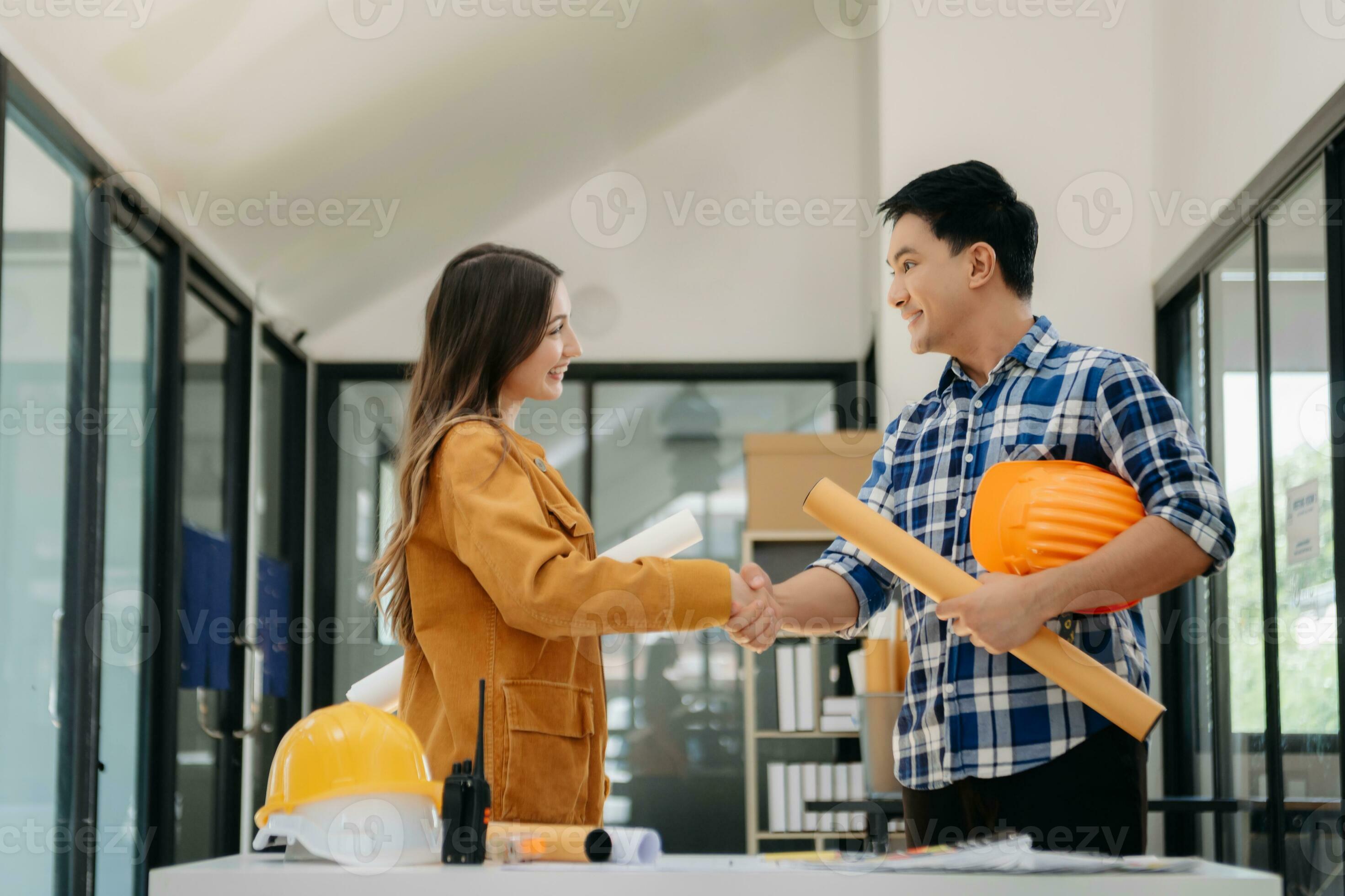Engineer teams meeting working together wear worker helmets hardhat with on architectural ...
