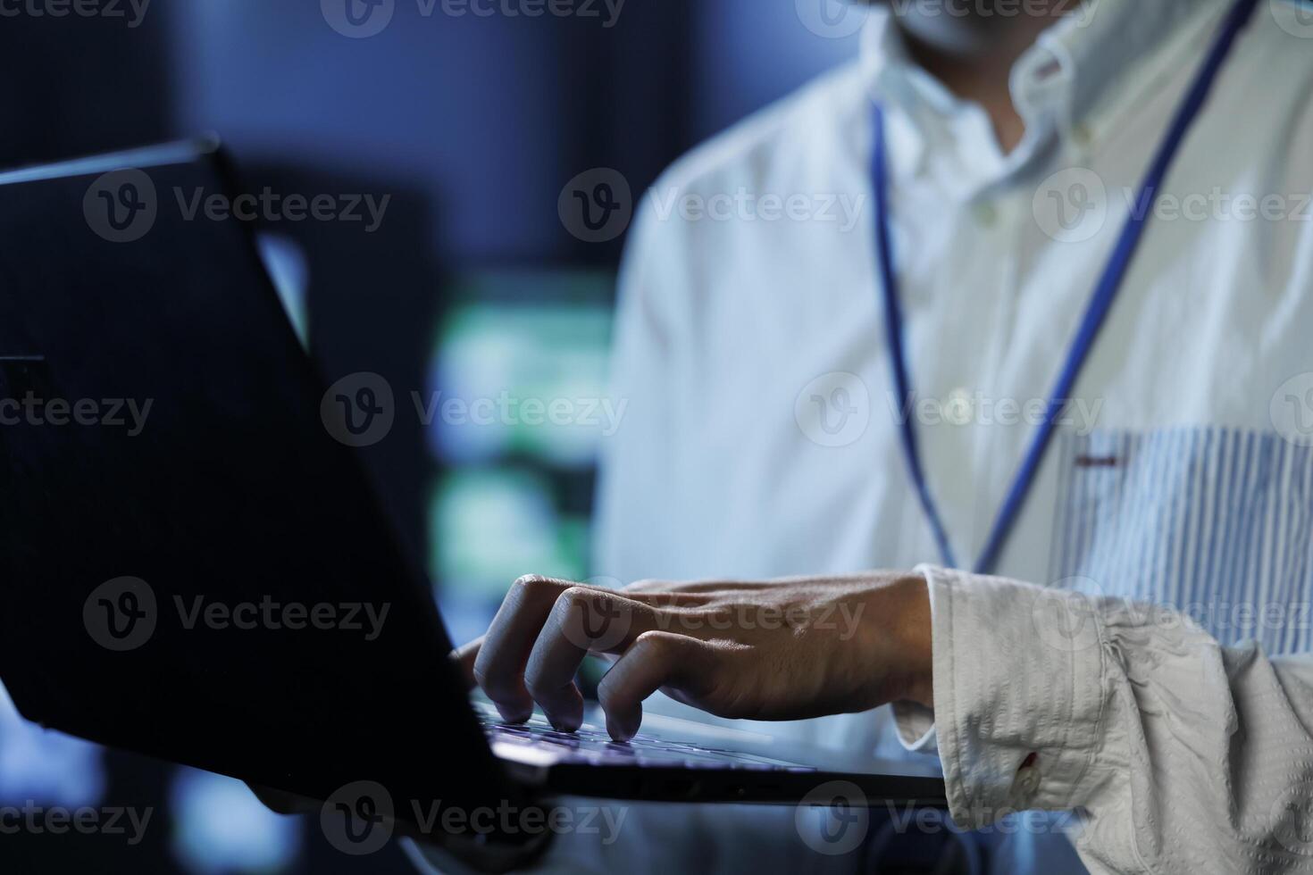 Man Between Server Hub Rows Providing Processing Resources For