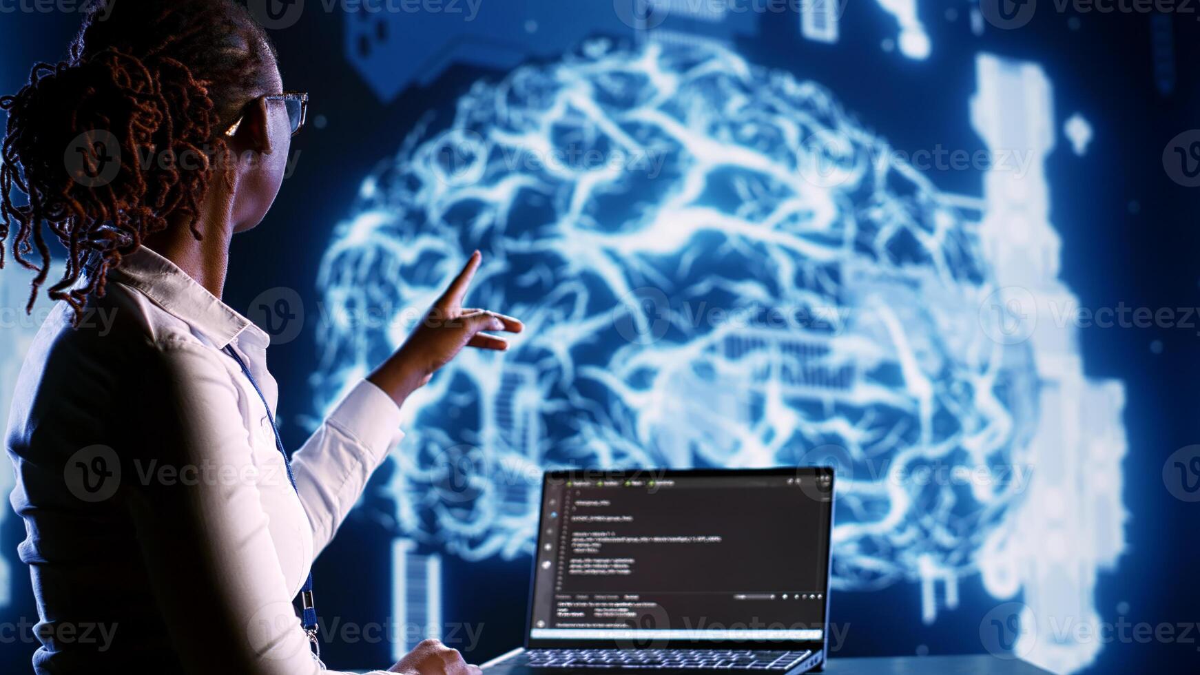 Overseeing manager writing artificial intelligence script code in startup workspace on tablet ...