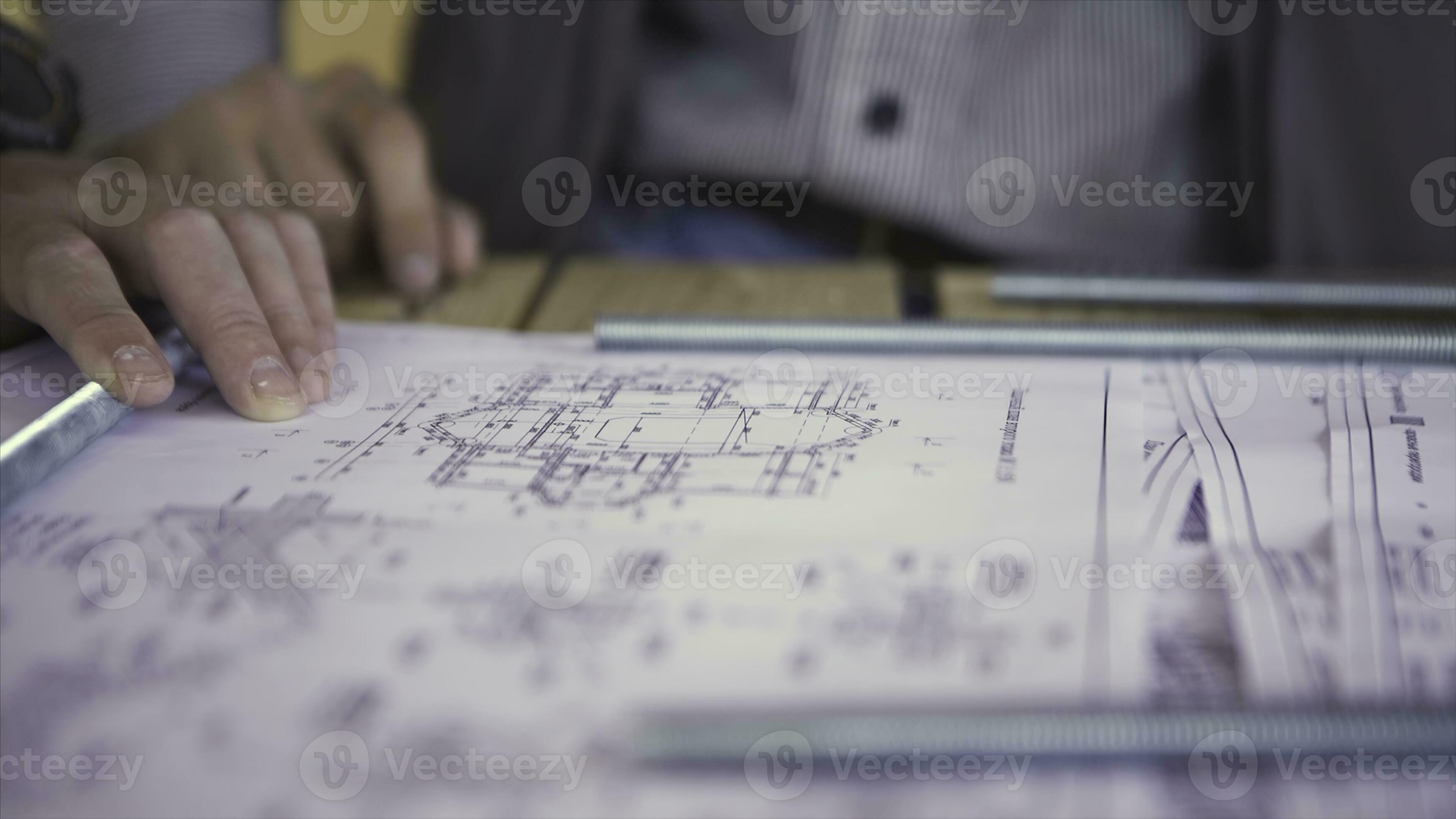 Close up view on engineer hand pointing at technical drawings. Men ...