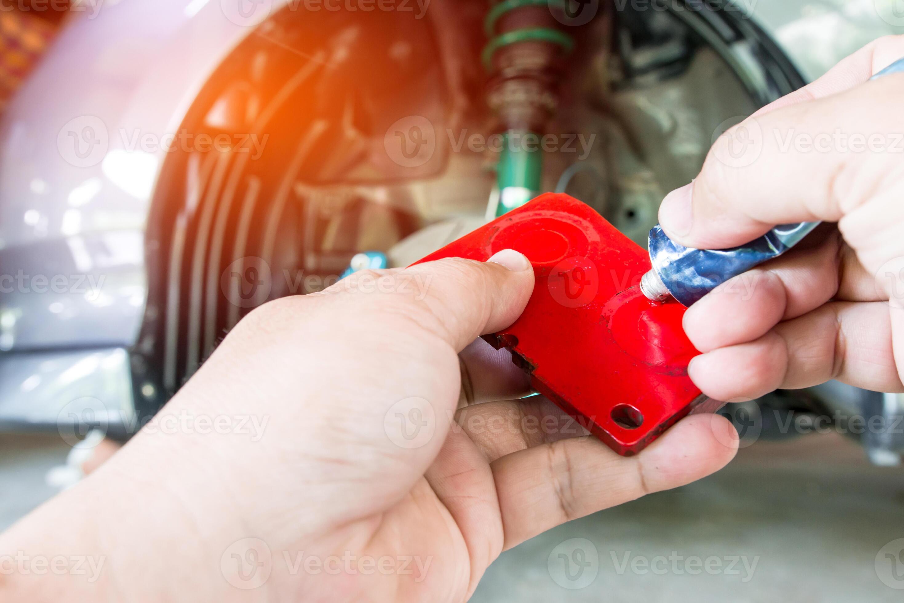 Close Up Hand A Man Apply Grease On New Brake Pad Of Car For Lubricate And Reduce Noise In