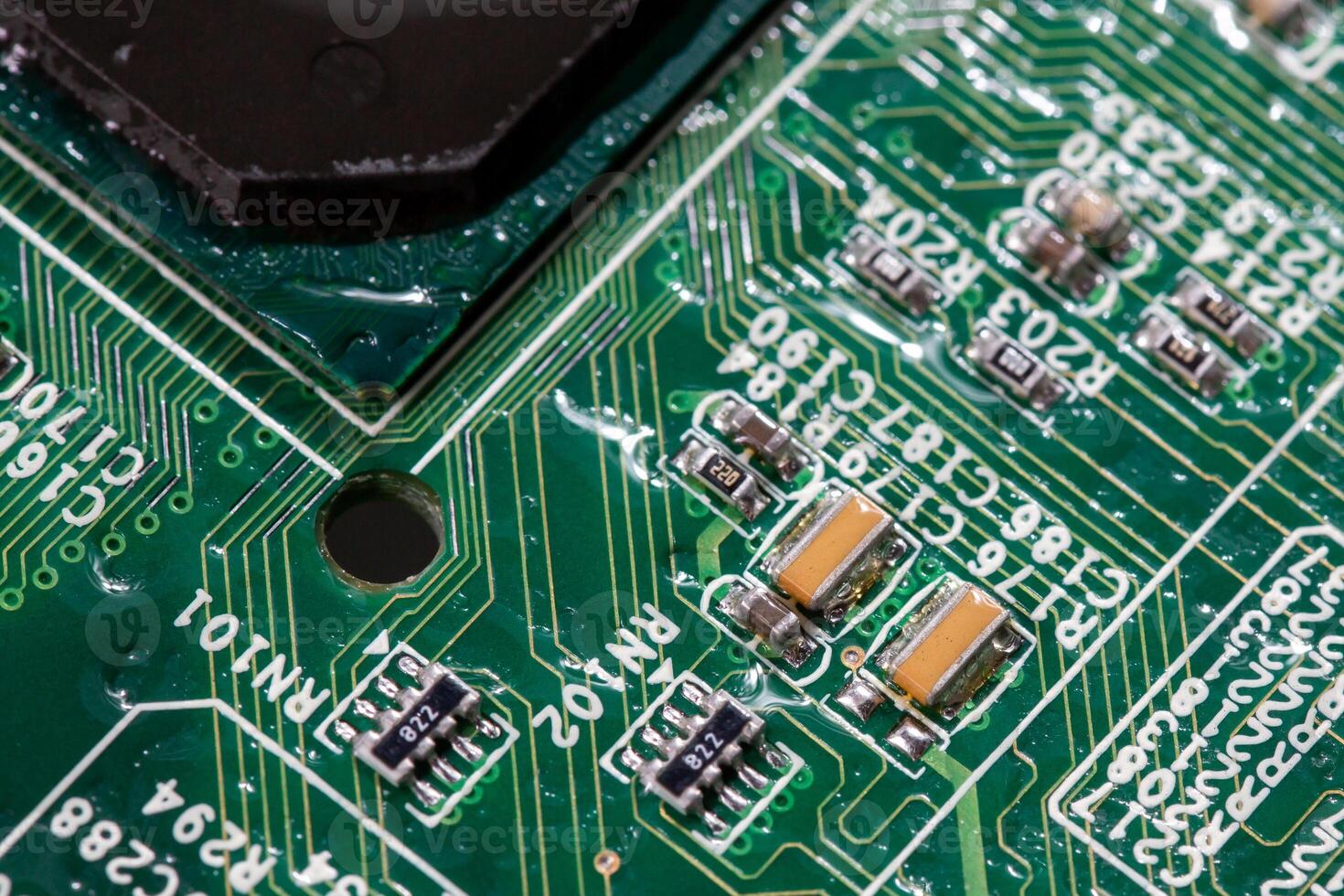 wet digital circuit board with microprocessors and components, closeup full-frame macro ...