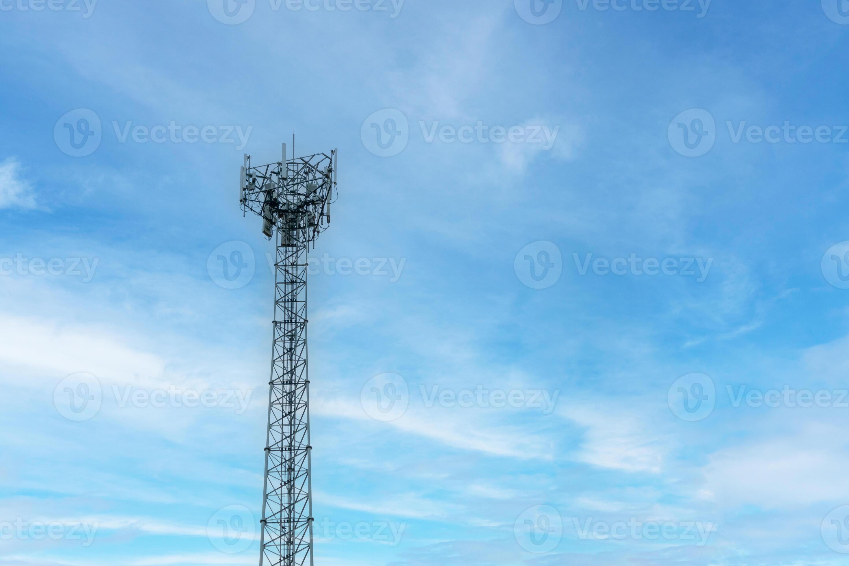 Internet signal tower or mobile phone signal tower isolated on blue sky background texture ...