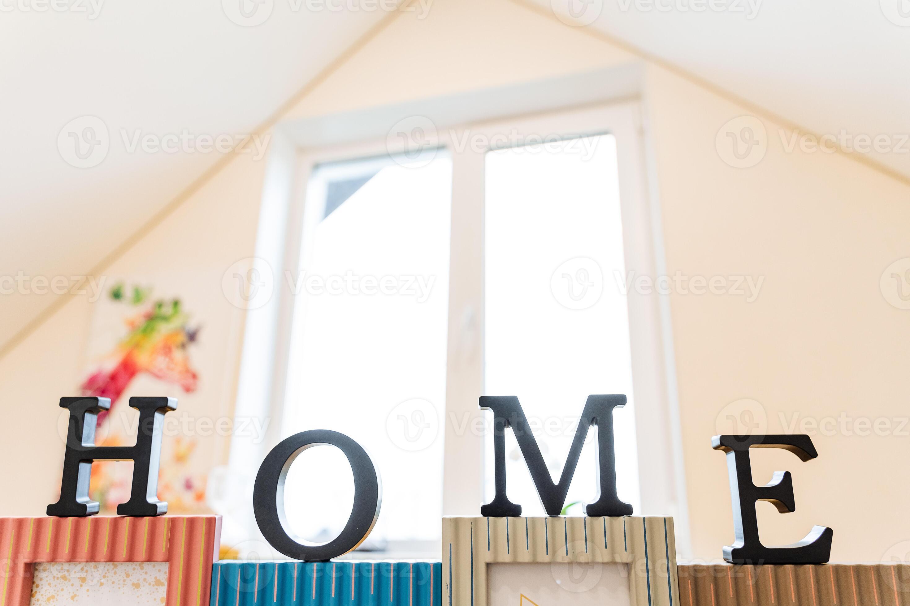 the word house is photographed close-up against a window, the inscription house, macro ...
