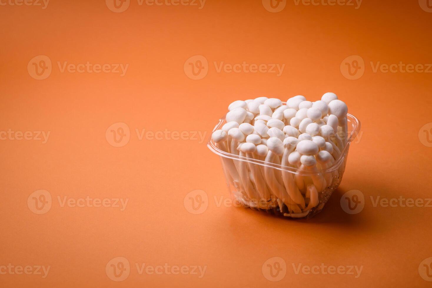 Small White Edible Beech Mushrooms With Salt And Spices On A Plain Background 38323952 Stock