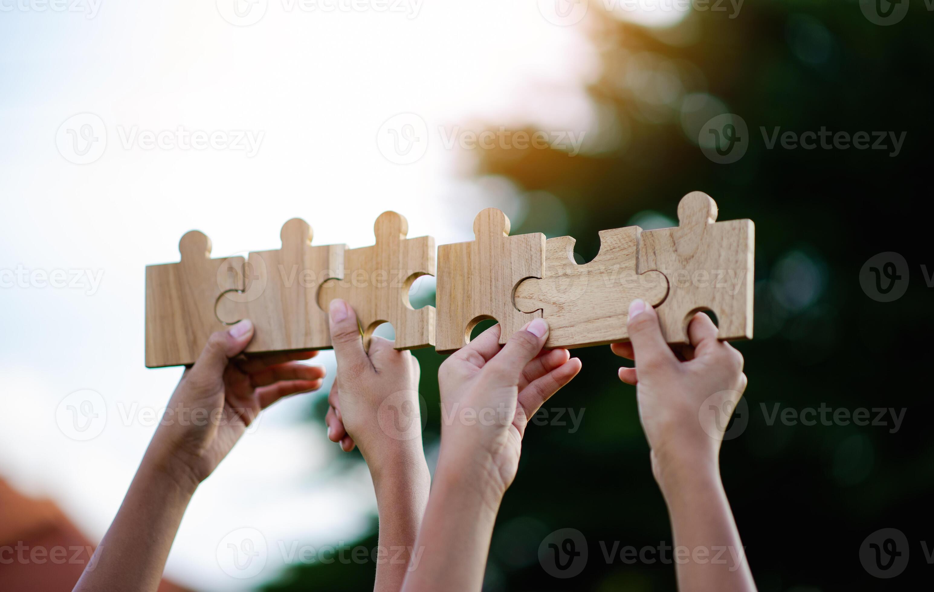 Jigsaw puzzle of great group cooperation, unity and happy working ...