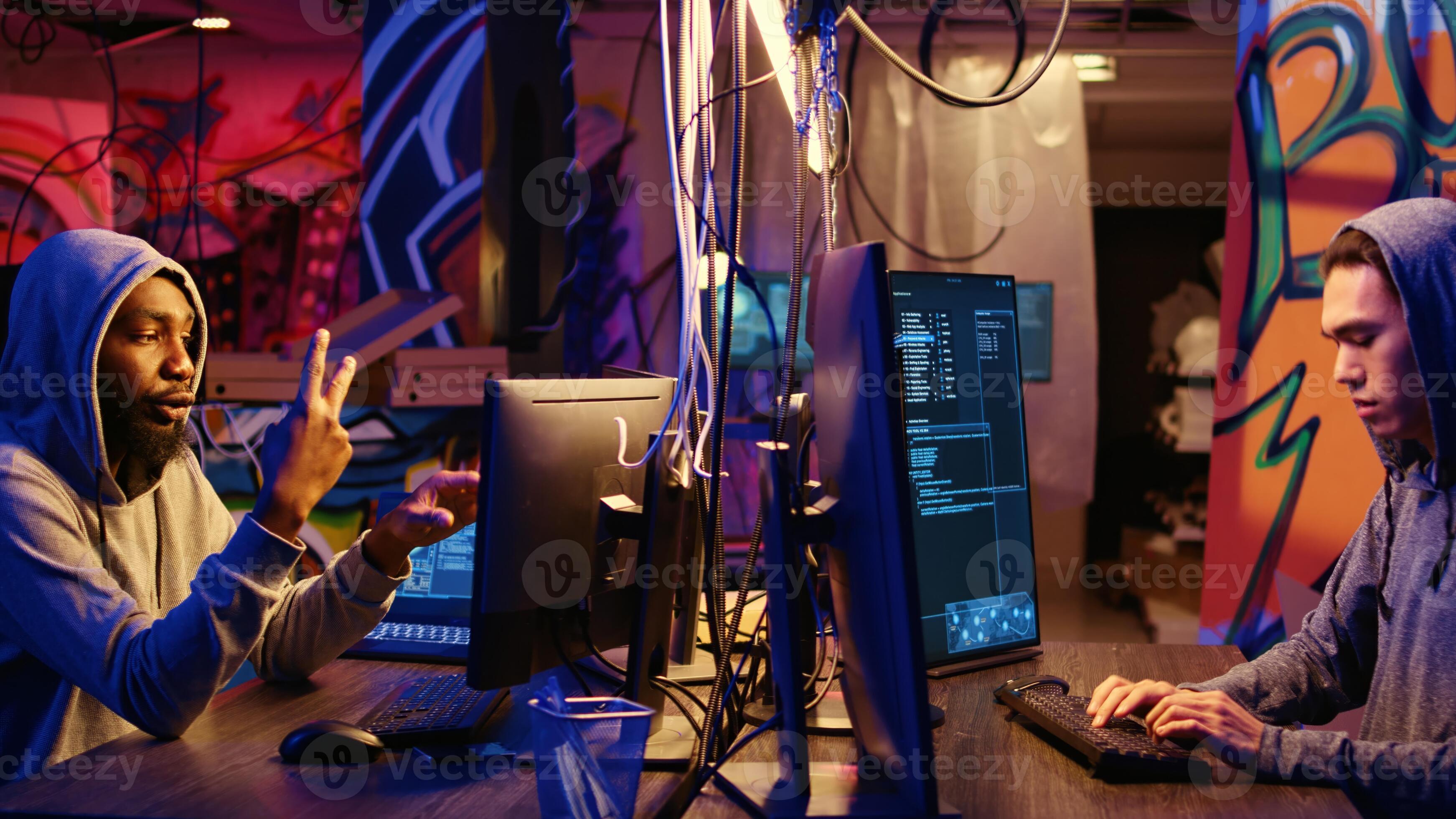 Experienced hackers writing lines of code in computers from their ...