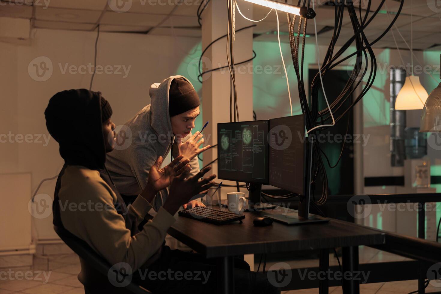 Team Of Online Criminals Hacking Computer System At Night Looking At Firewall Encryption Before