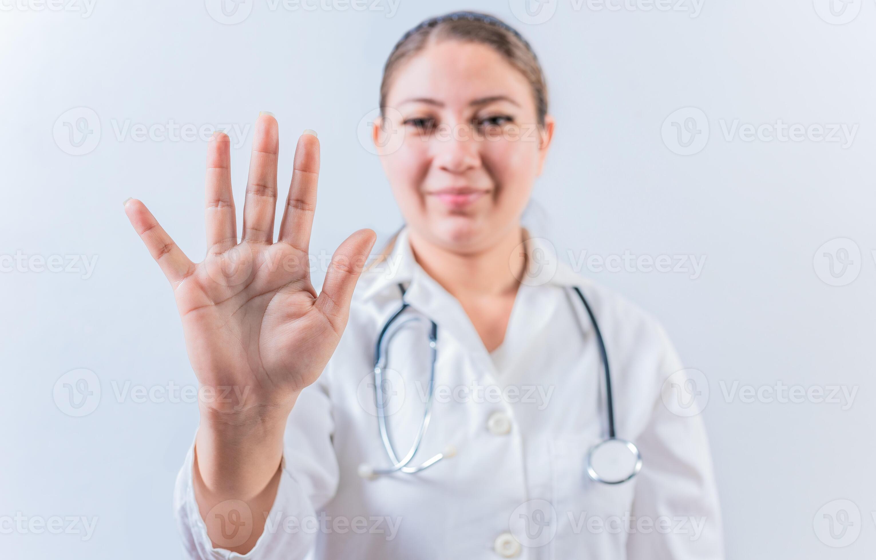 Female doctor counting number FIVE isolated. Young female doctor ... Female doctor counting number FIVE isolated. Young female doctor ...
