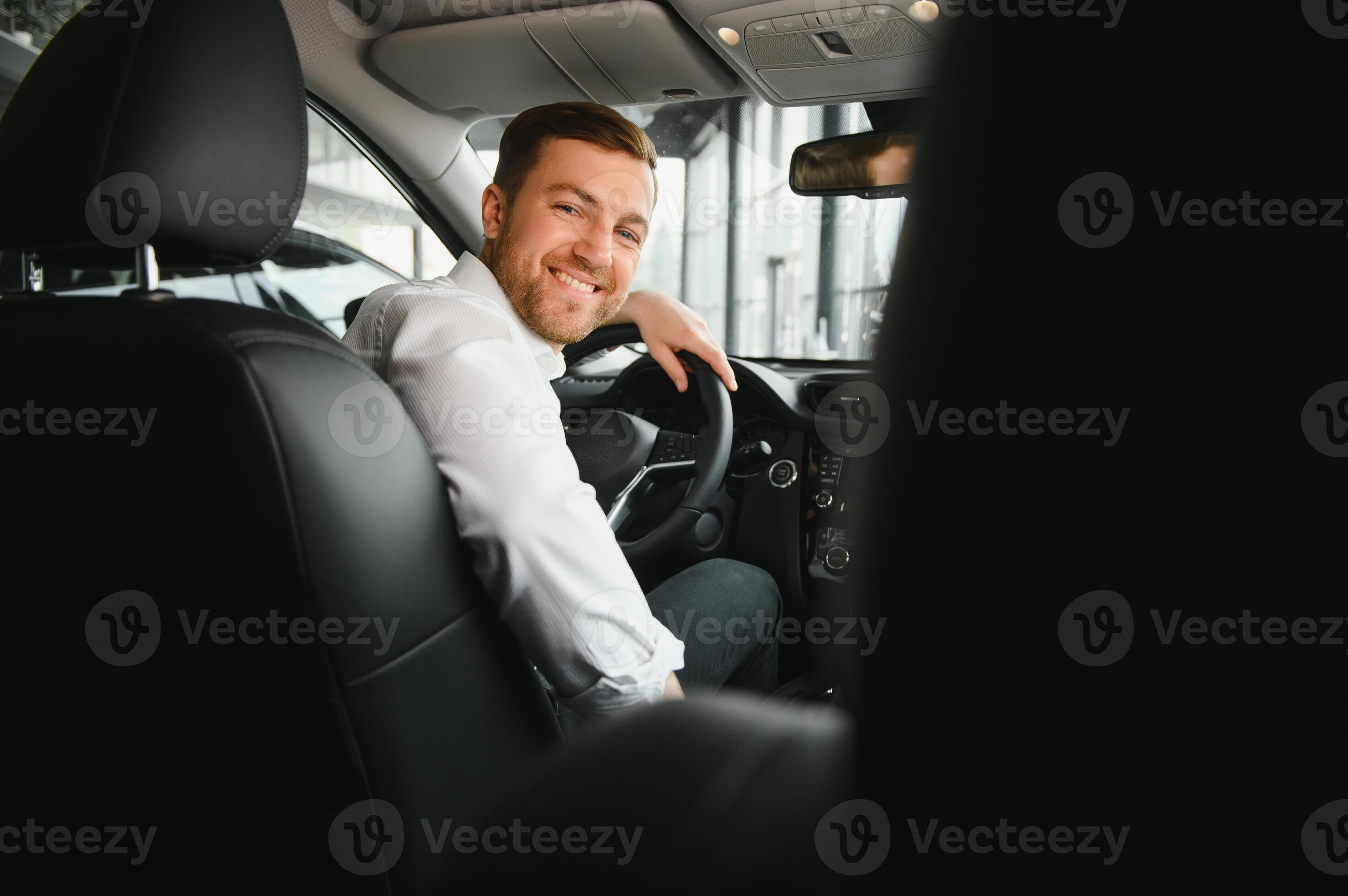 Taxi Driver Smiling While Turning Over To The Backseat Looking Talking