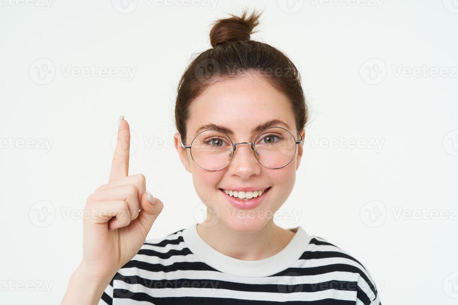 Image Of Woman In Glasses Pointing Finger Up Showing Advertisement On Top Standing Over White