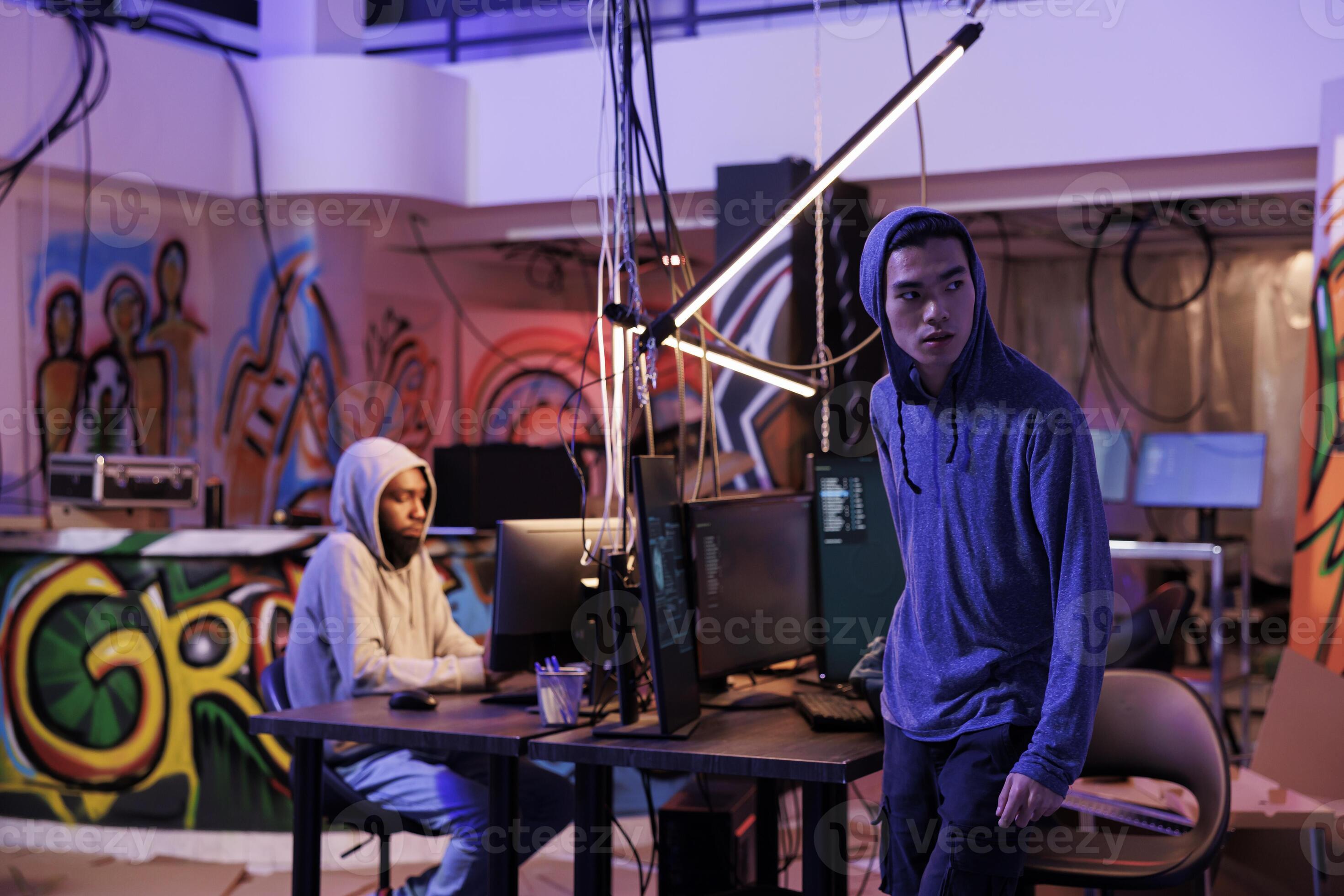 Suspicious Hacker Looking Away After Breaking Into Server And Doing Illegal Activity Young