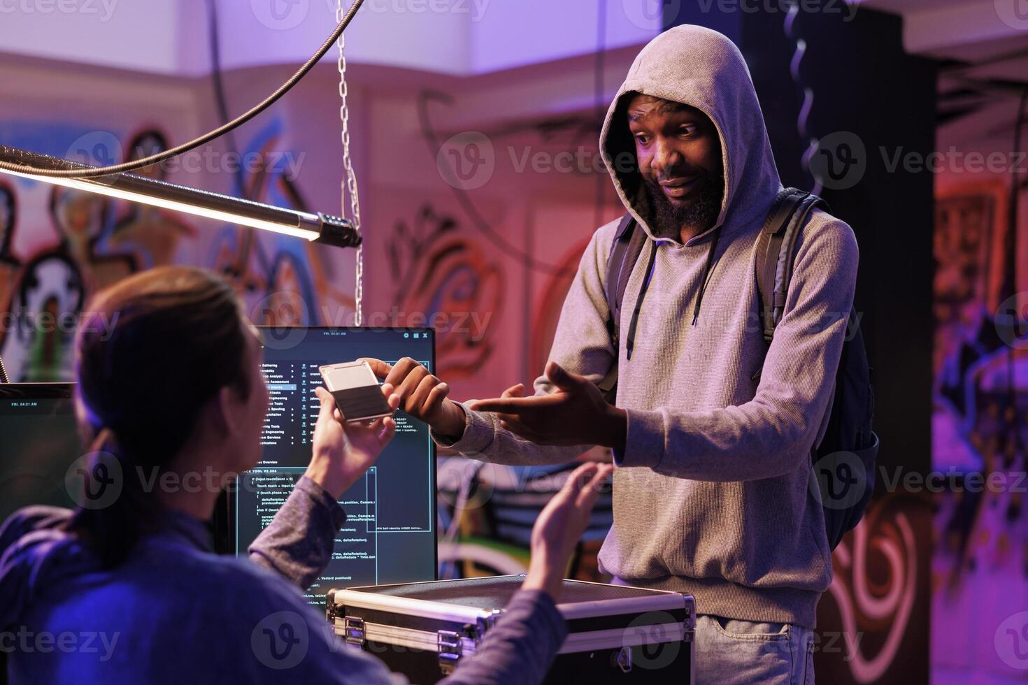 African american hacker in hood bringing ssd with illegal spyware to ... African american hacker in hood bringing ssd with illegal spyware to ...