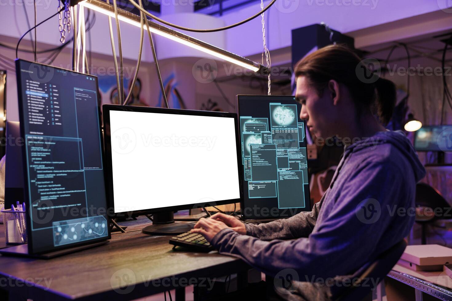 Scammer Hacking Using Computer With Empty White Screen In Abandoned