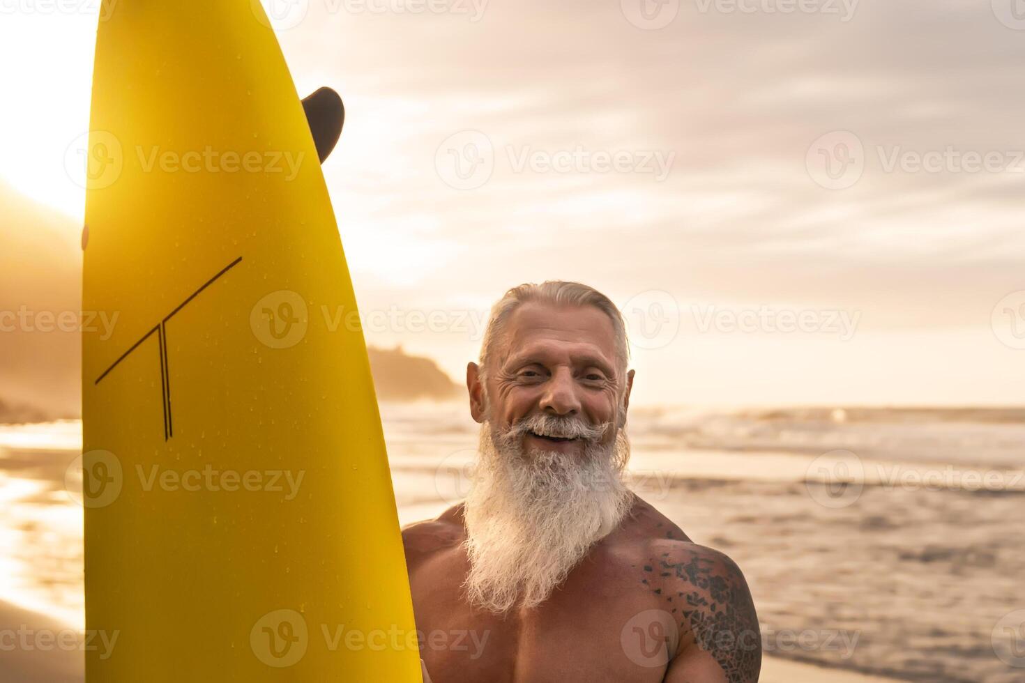 Happy Fit Senior Having Fun Surfing At Sunset Time Sporty Bearded Man