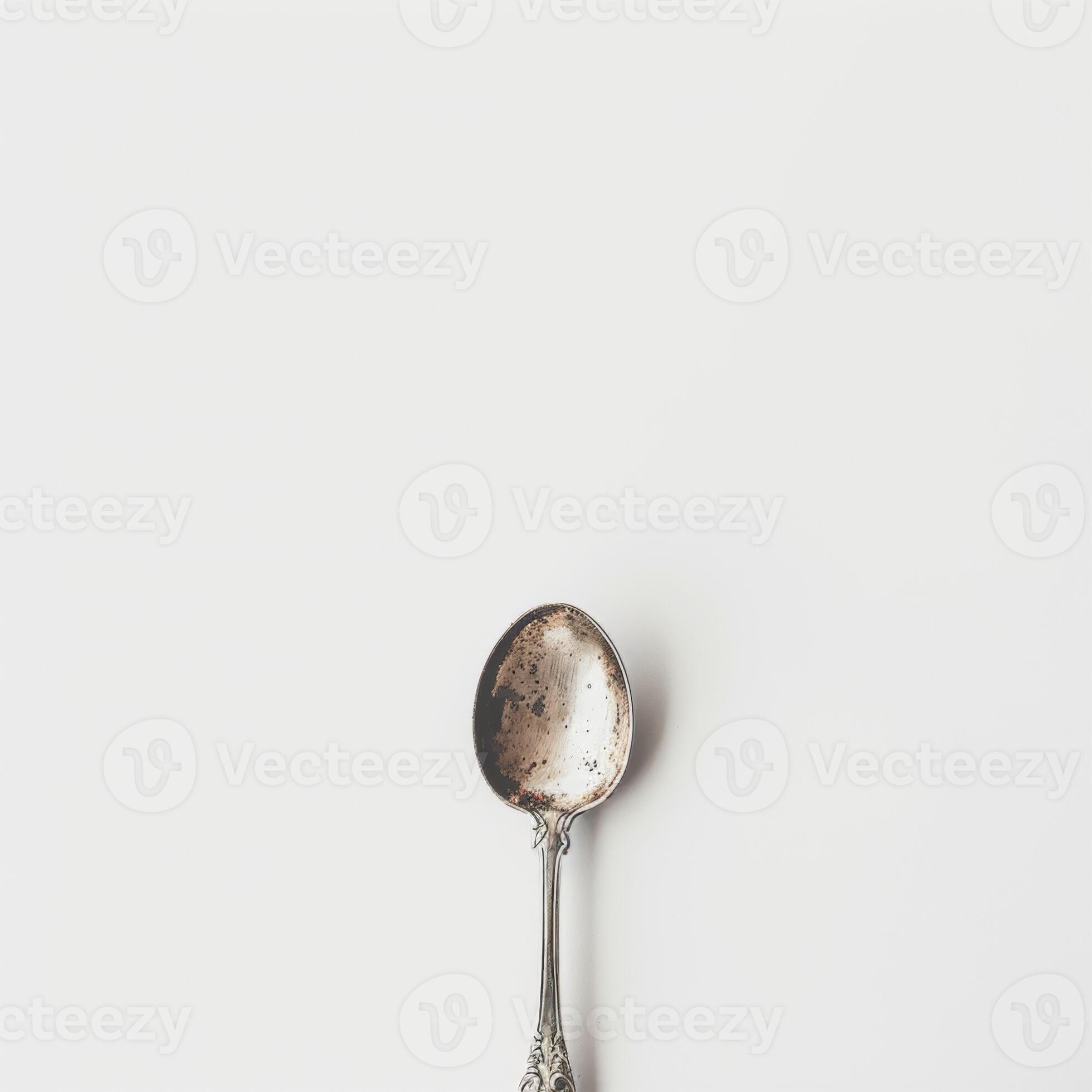 AI generated minimalistic style silver spoon on white background top ...