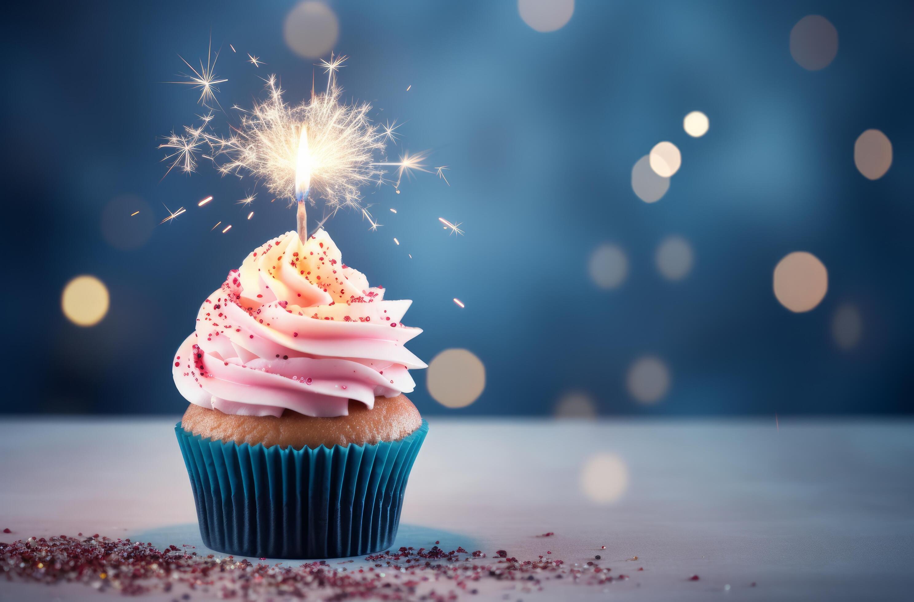 AI generated a pink cupcake with a candle in front of sparklers 40286604 Stock Photo at Vecteezy