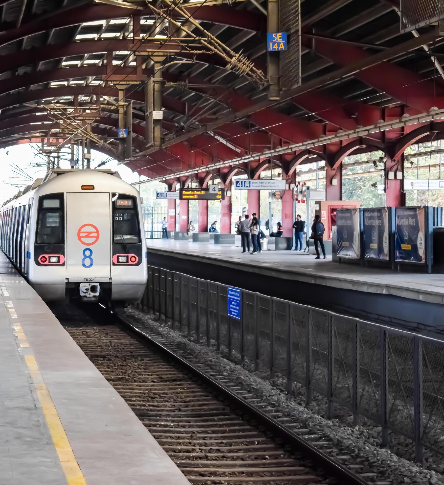 New Delhi, India, February 17 2024 - Delhi Metro train arriving at Jhandewalan metro station in ...