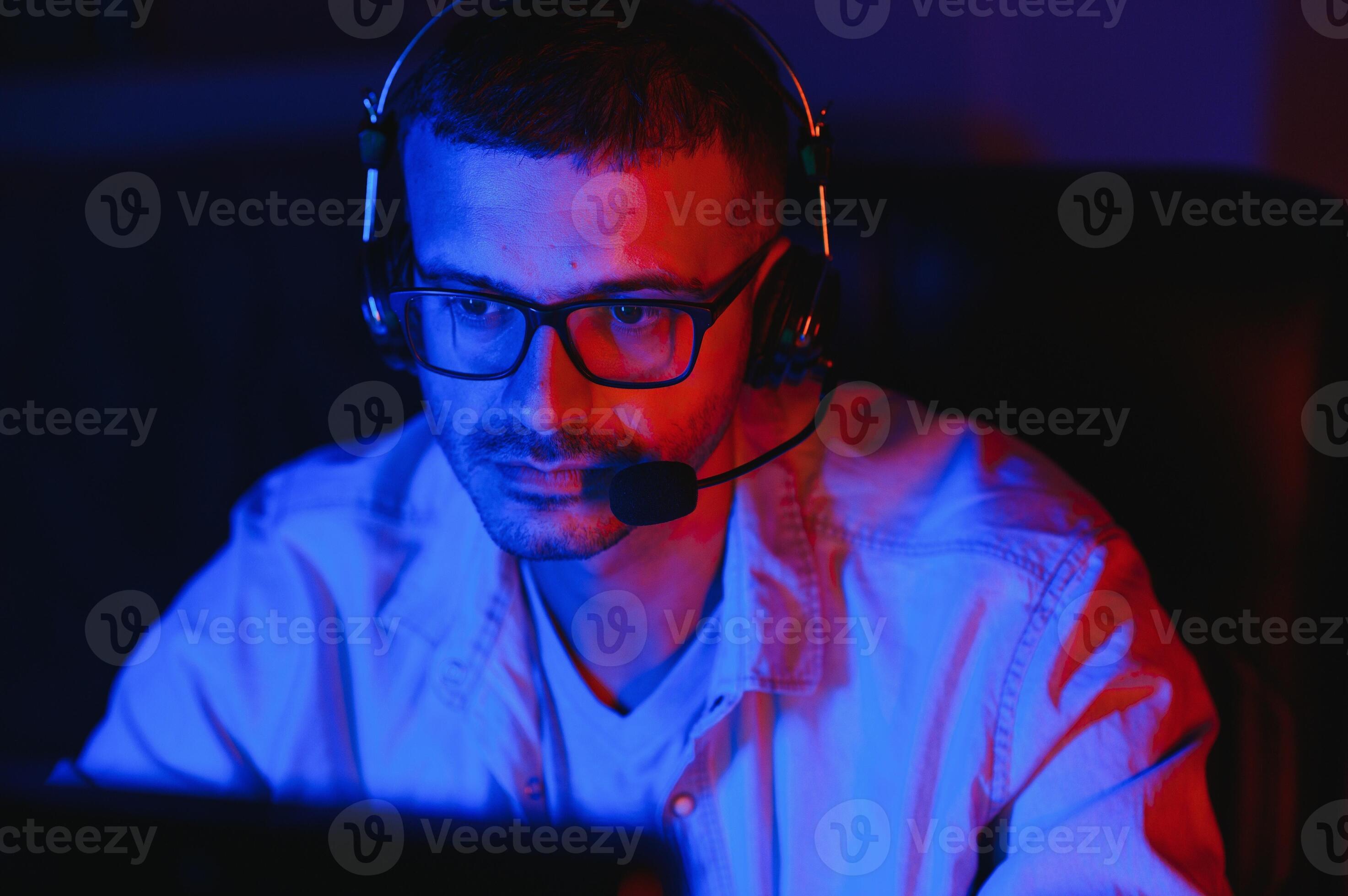 Handsome young male software developer programming codes while working ...