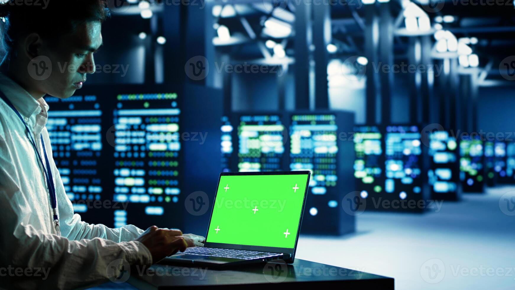 Asian technician using mockup laptop to implement artificial ... Asian technician using mockup laptop to implement artificial ...
