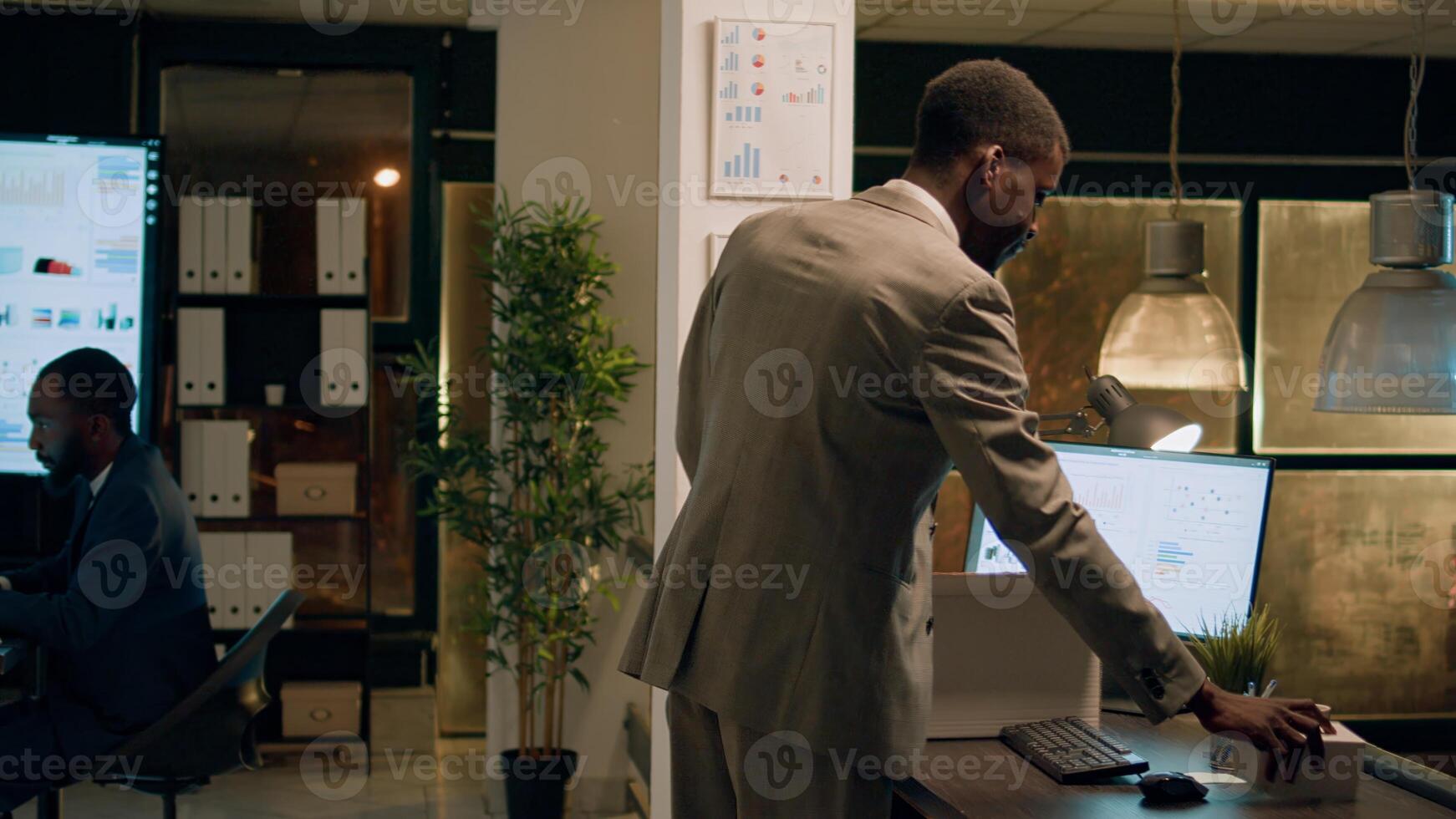 Employee finishing last office day, quitting stressful job after being handed too many tasks ...