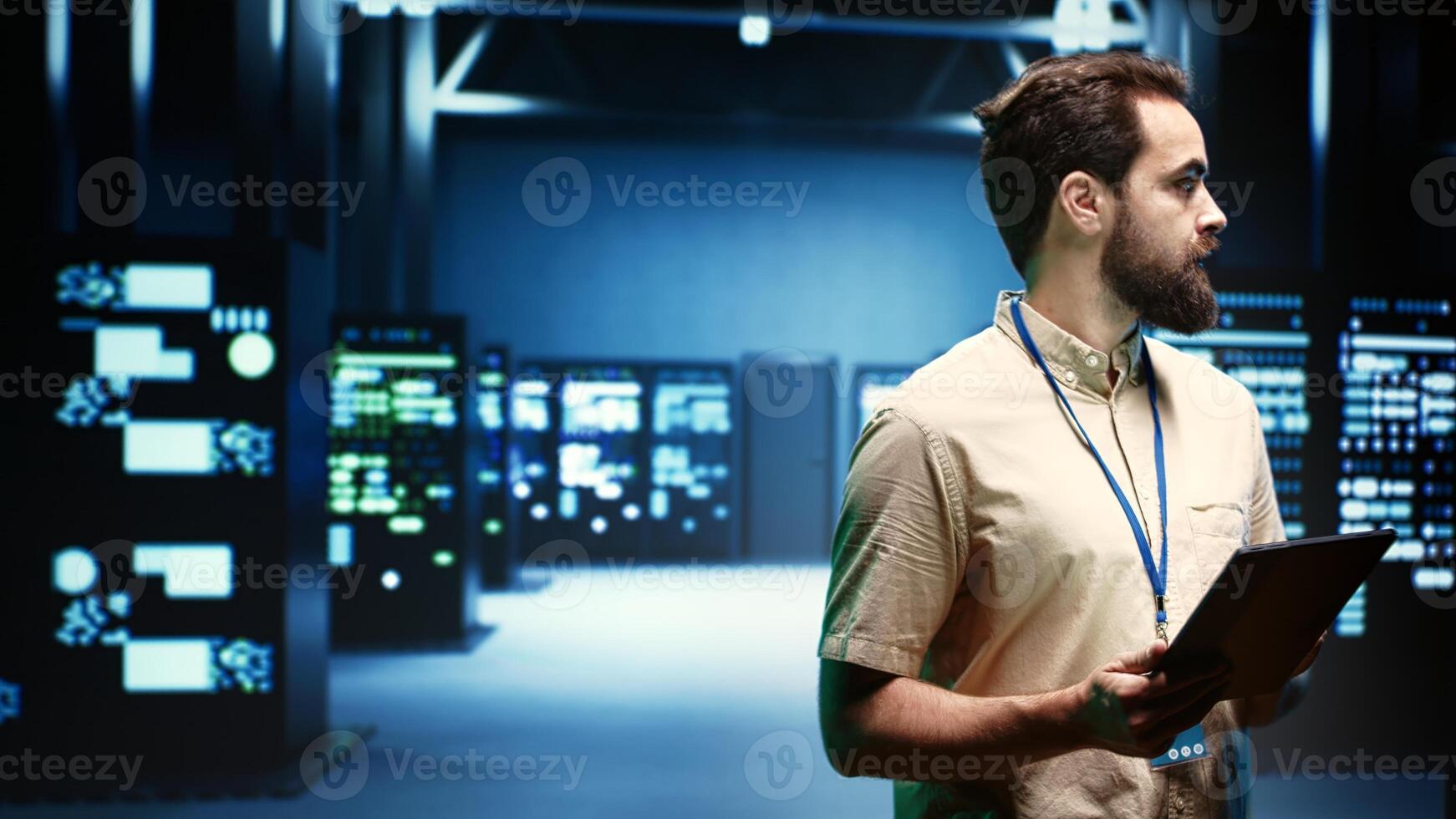 IT specialist in server room ensuring valuable data remains secure from potential threats ...