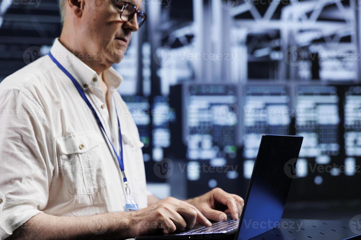 Senescent computer scientist in data center providing dedicated VPN ...