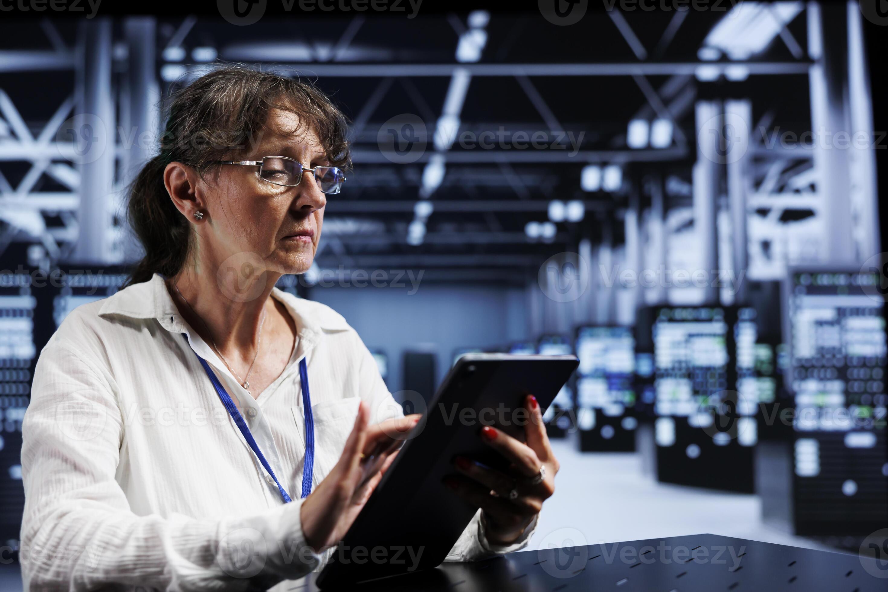 Old Computer Scientist Using Tablet To Assess Server Cybersecurity Problems Arising Due To