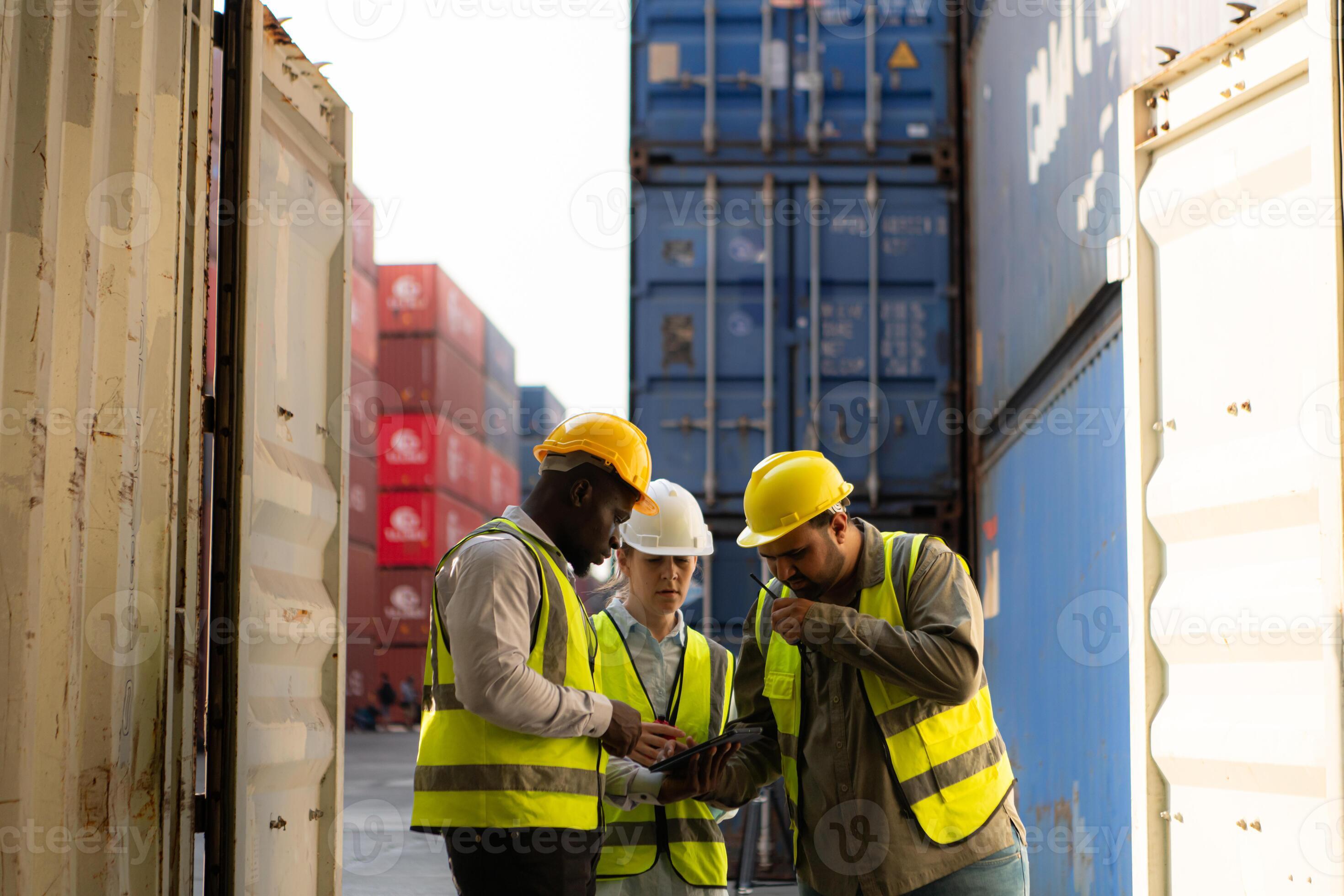 Group of workers in an empty container storage yard, The condition of the old container is being ...