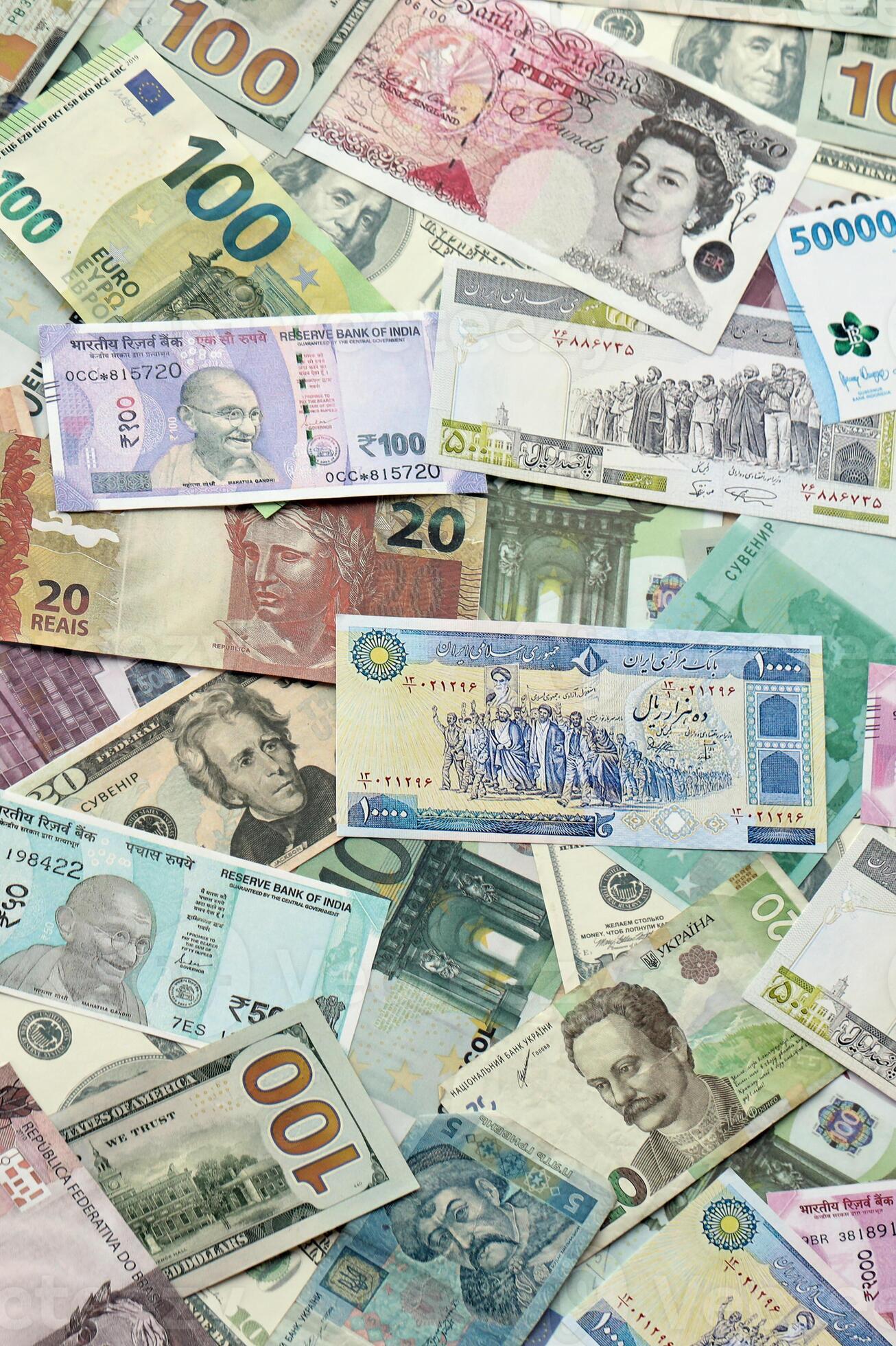 Many banknotes of different currency. Background of big amount of ...