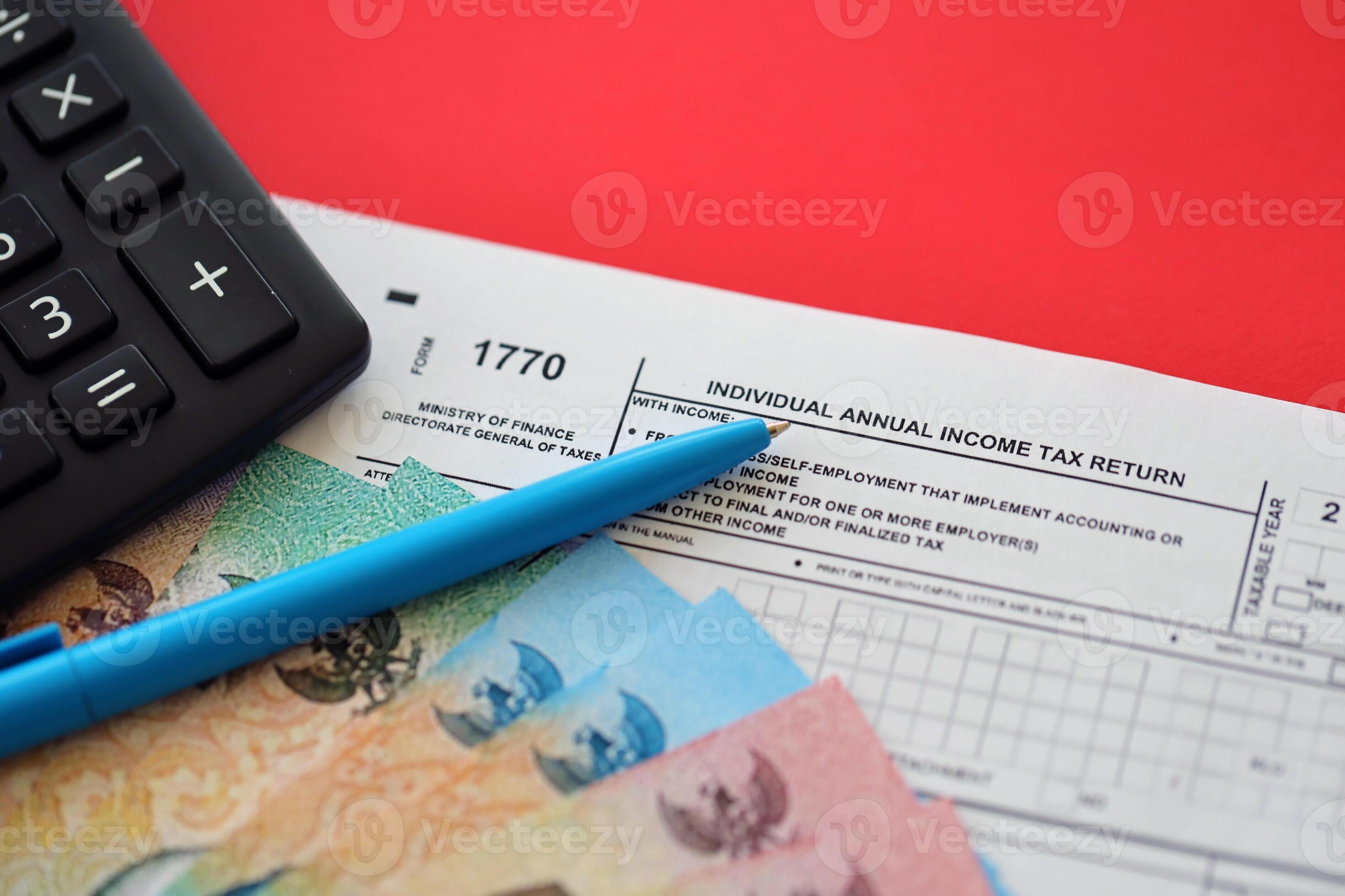 Indonesian tax form 1770 Individual Income Tax Return and pen on table 40980735 Stock Photo at ...