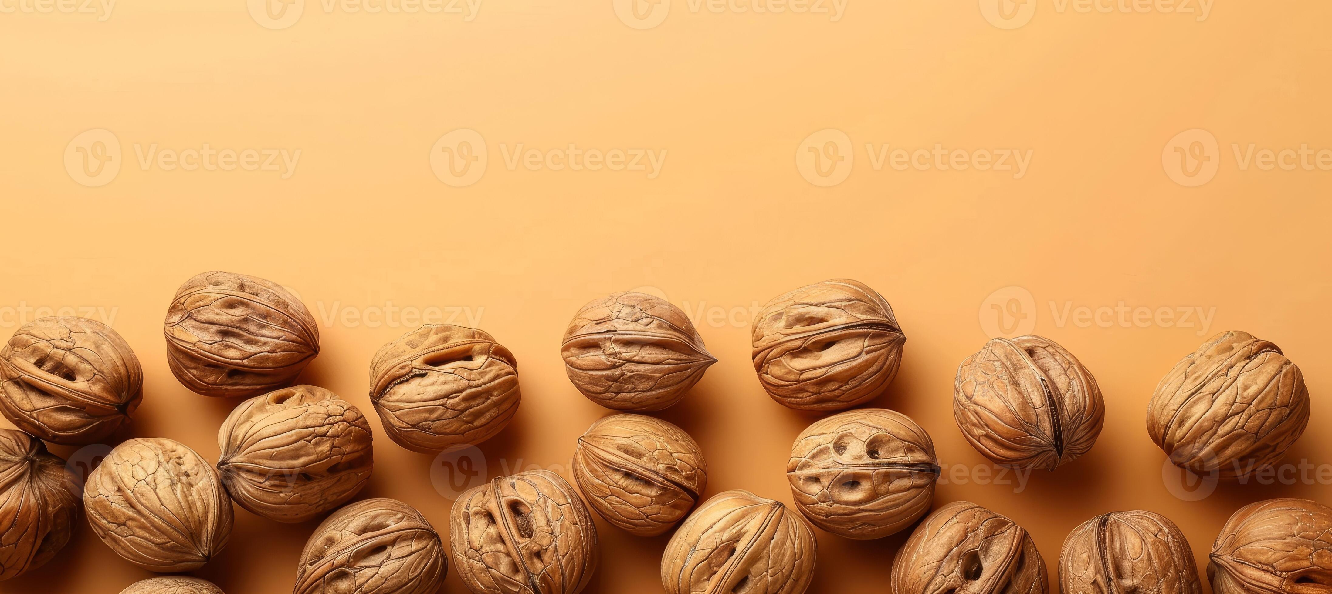 AI generated Assorted nuts on light brown background with ample space ...