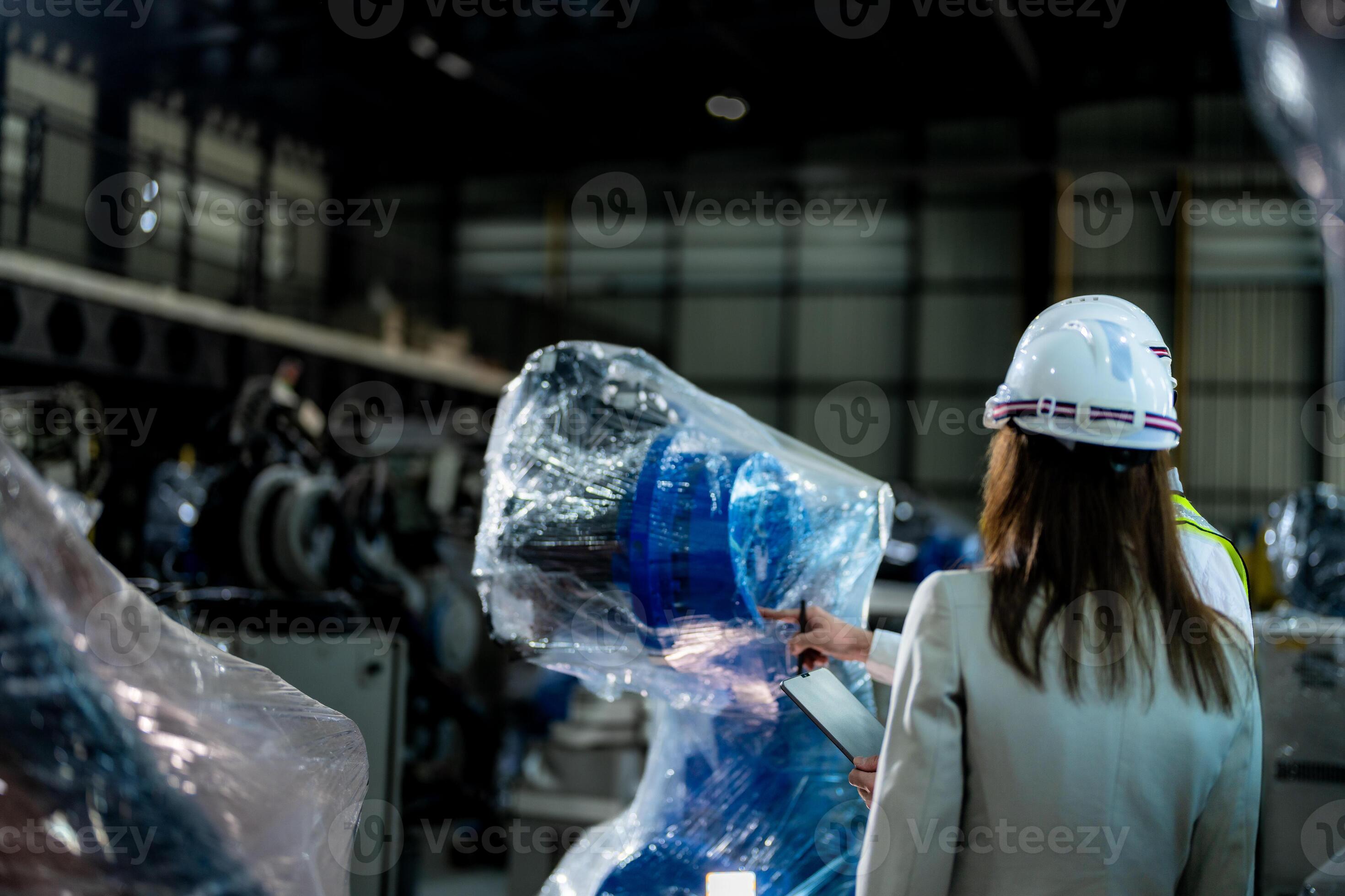 Business engineers meet and check control heavy machine robot arm ...