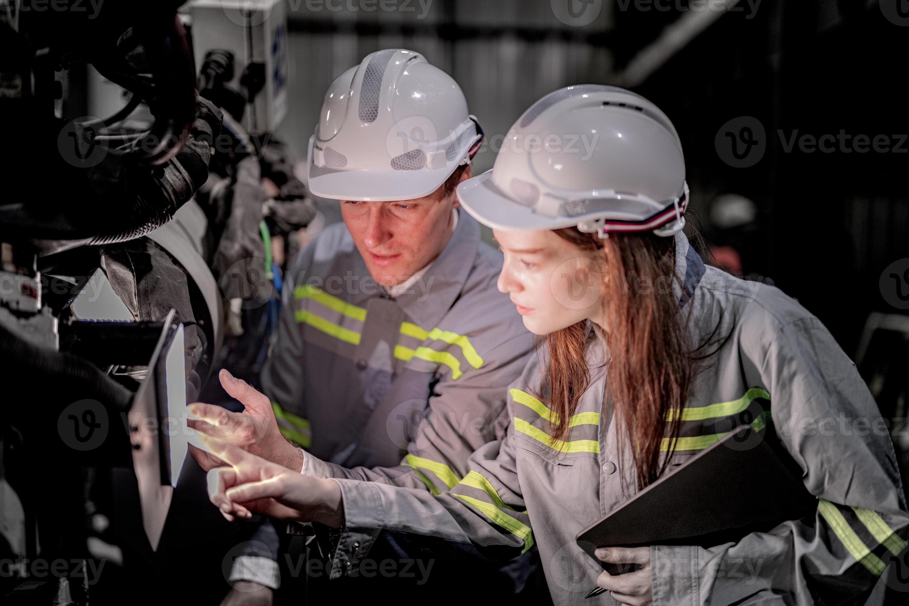 Business engineers meet and check control heavy machine robot arm ...