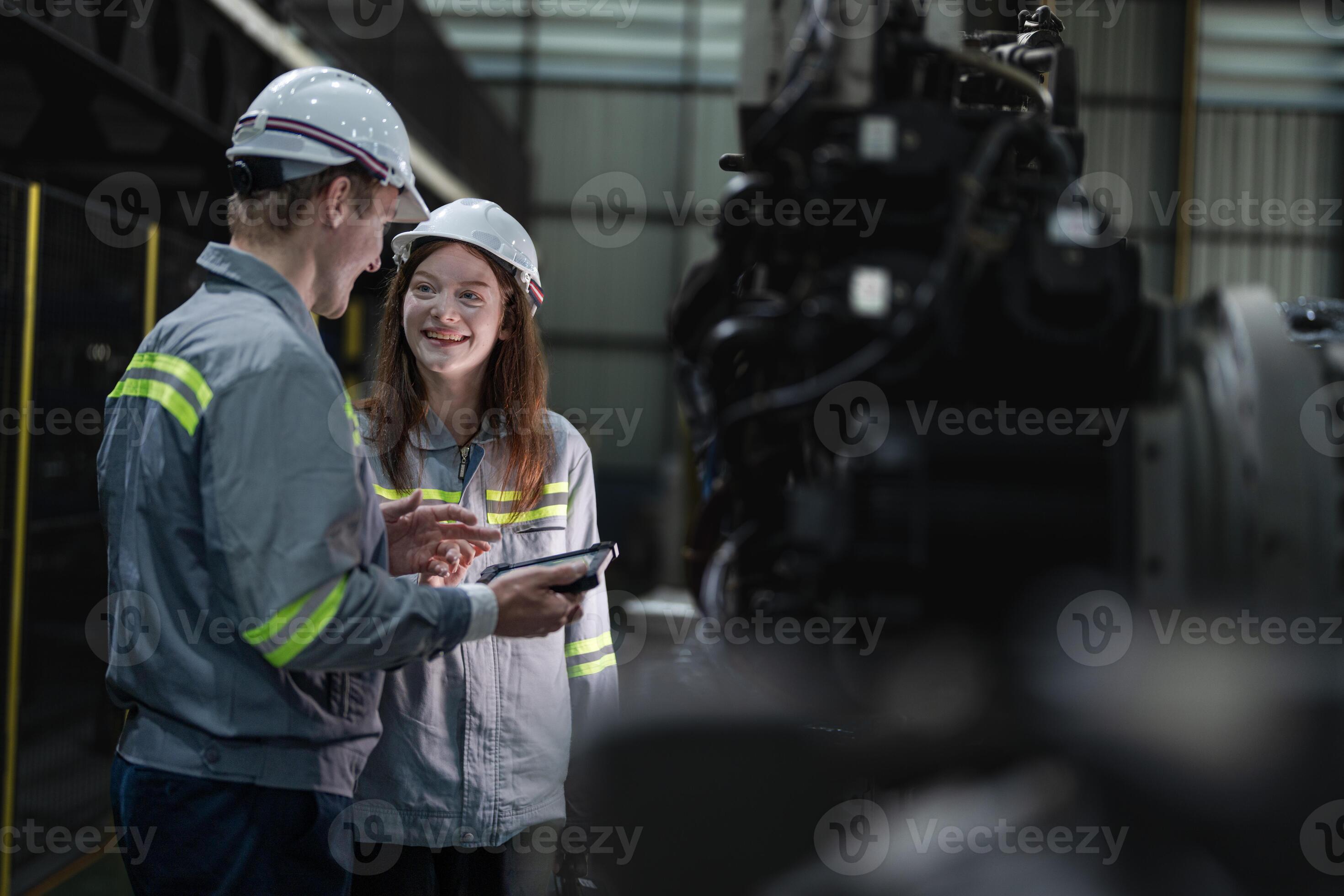 engineers check control heavy machine robot arm. Diverse Team of ...